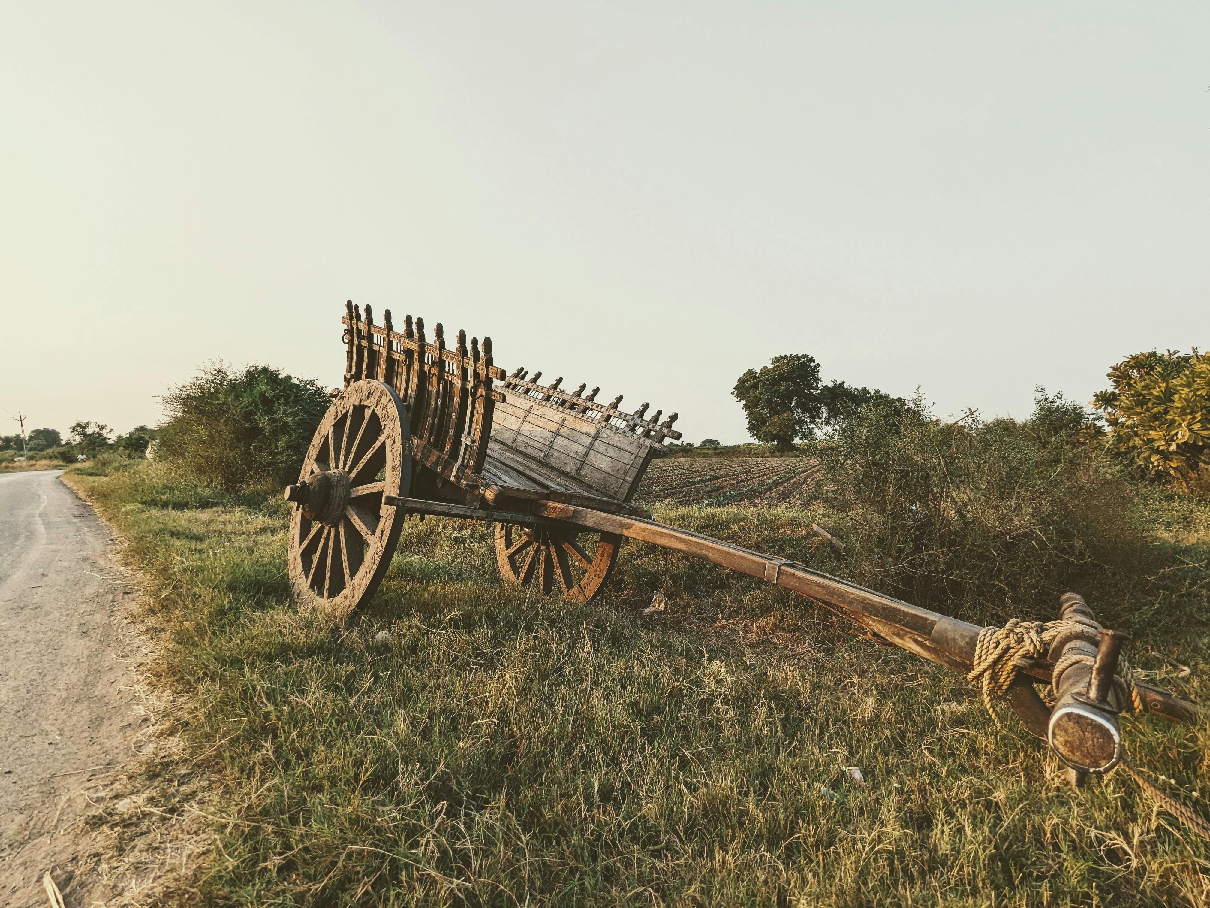 Traditional Wooden Cart Sitting on The Side of The Road · Free Stock Photo