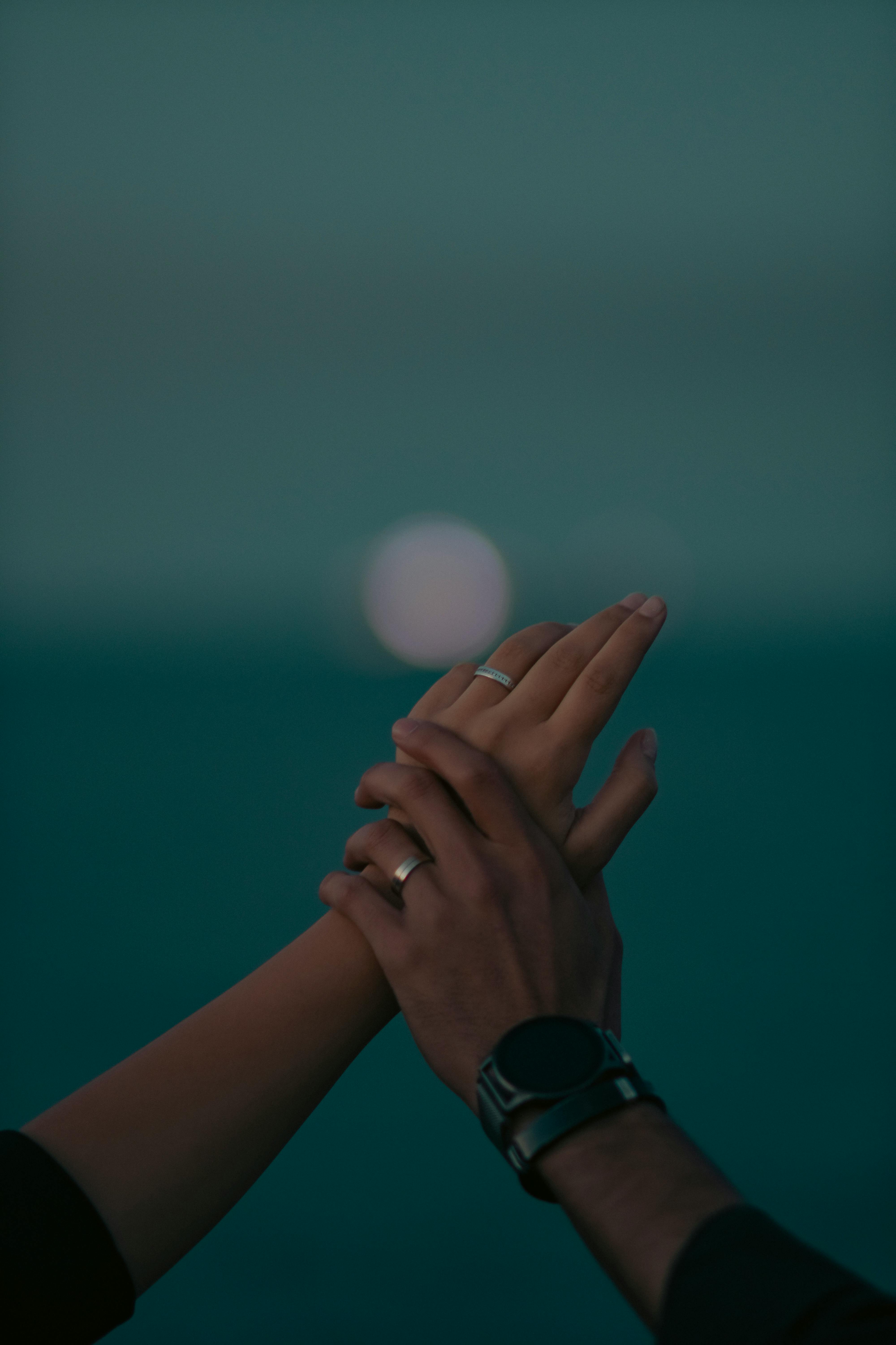 Close-Up Shot of Two People Holding Hands Together · Free Stock Photo