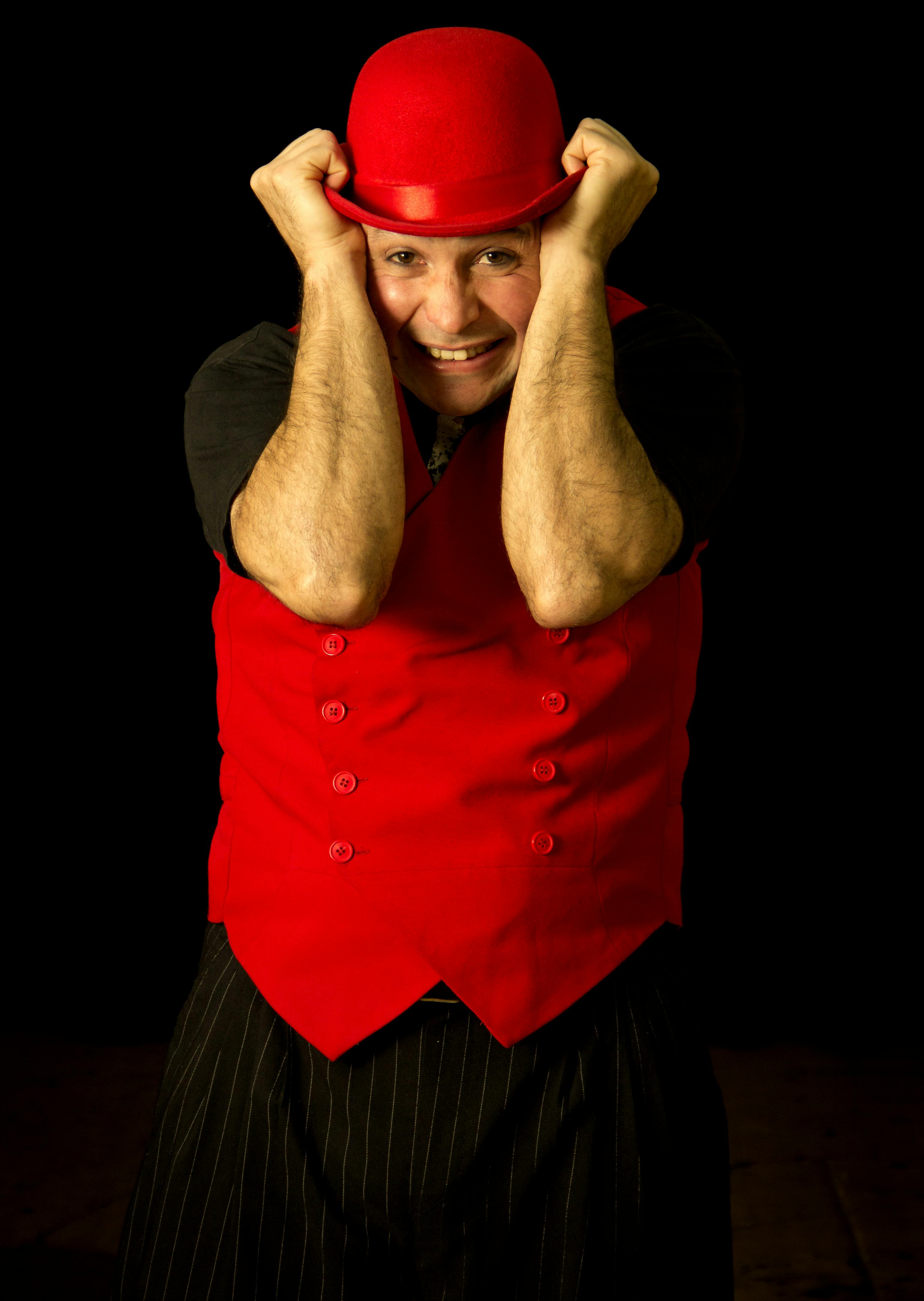 Man Posing in Red Costume · Free Stock Photo