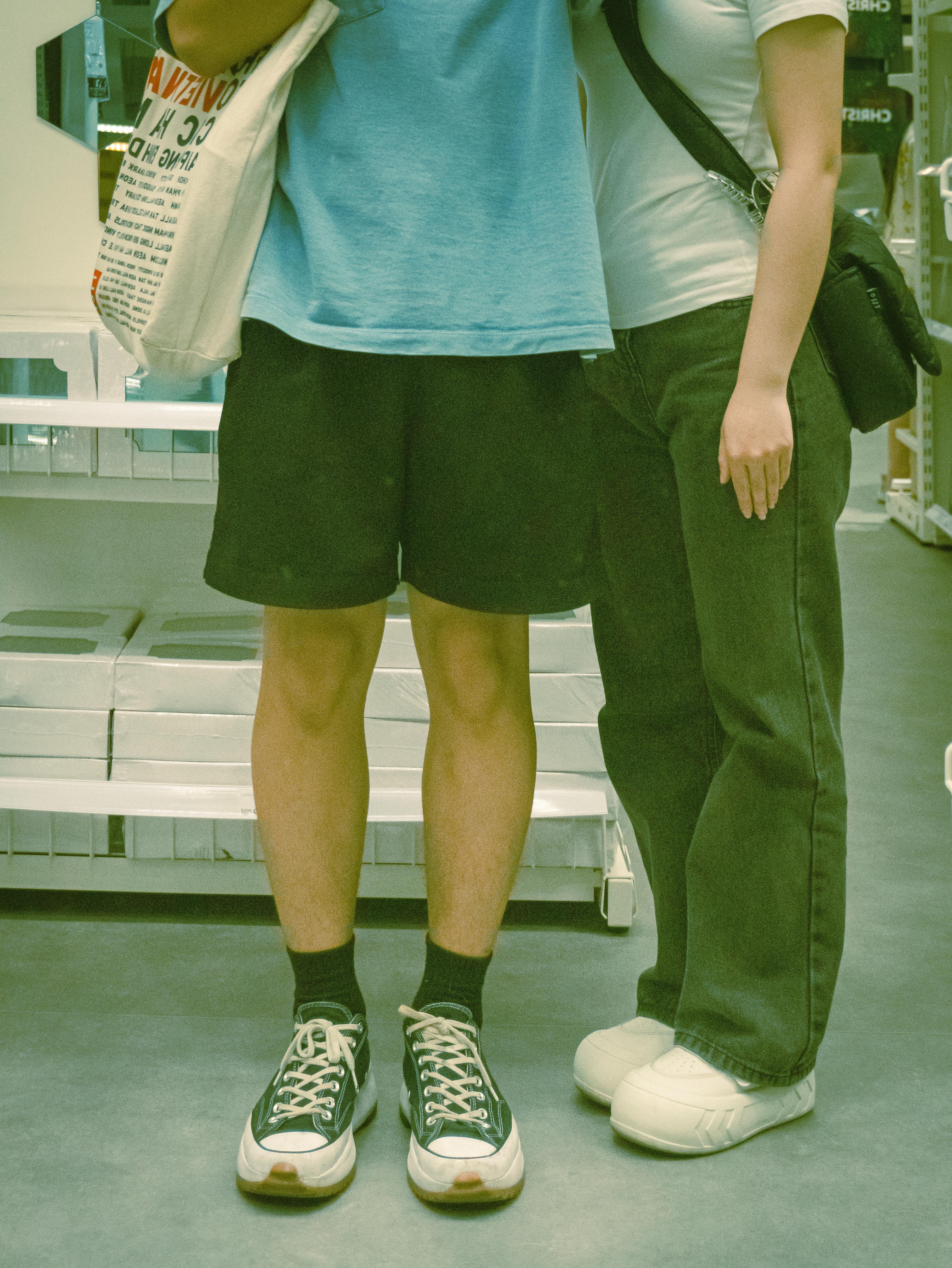 Legs of a Couple of Customers in the Store · Free Stock Photo