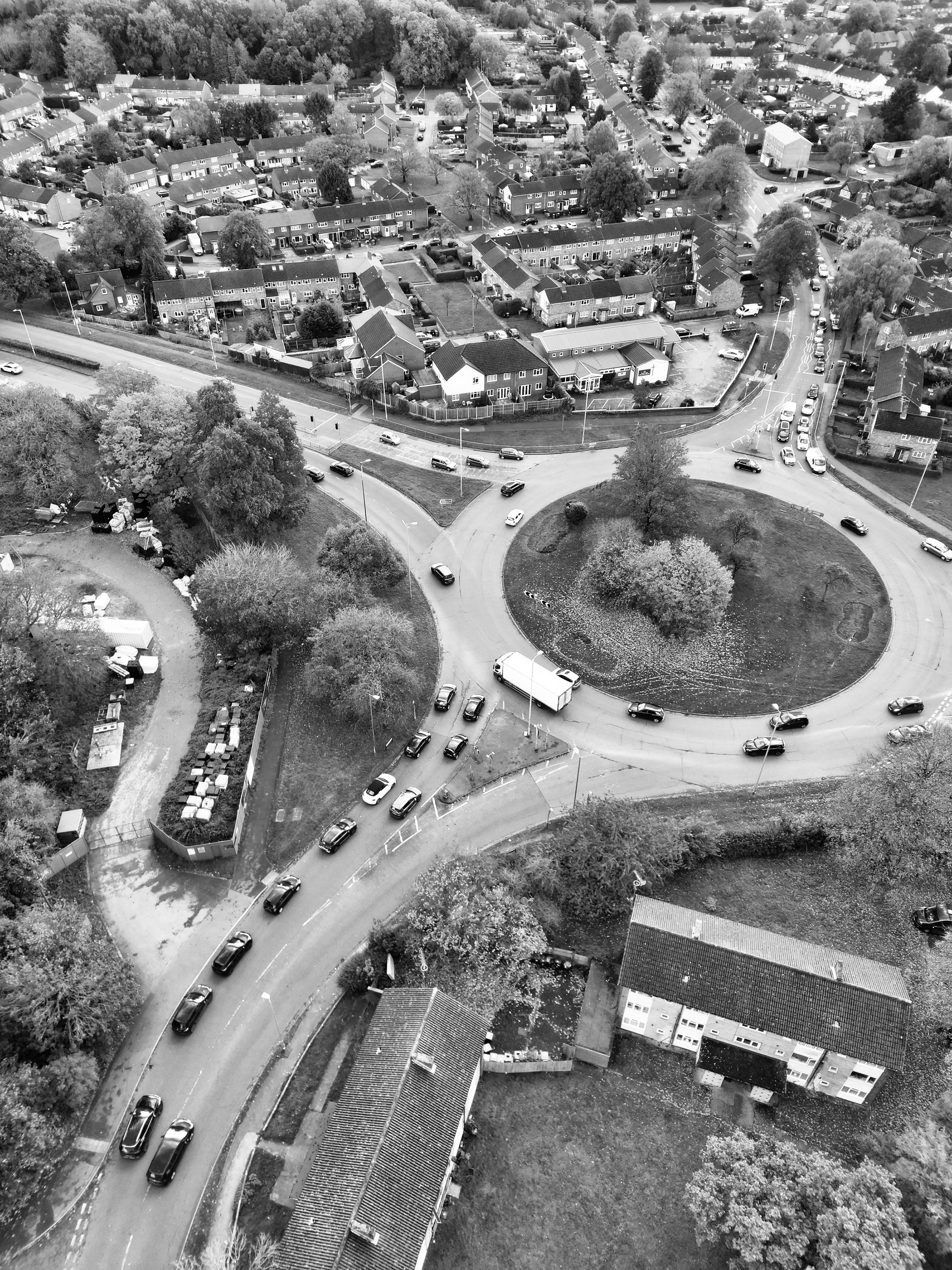 Grayscale Shot of a Roundabout in a City · Free Stock Photo