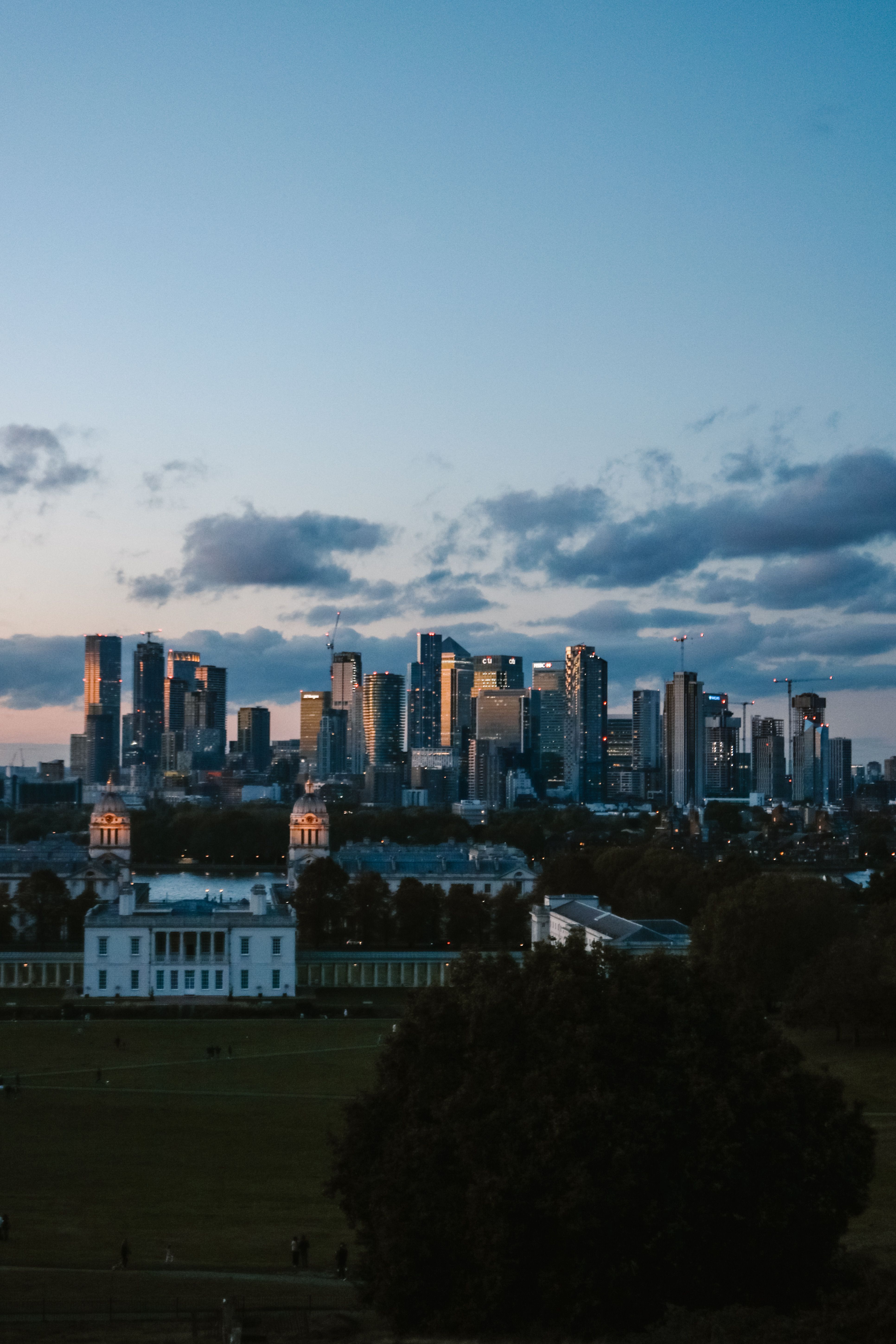 Skyscrapers behind Buildings in City · Free Stock Photo