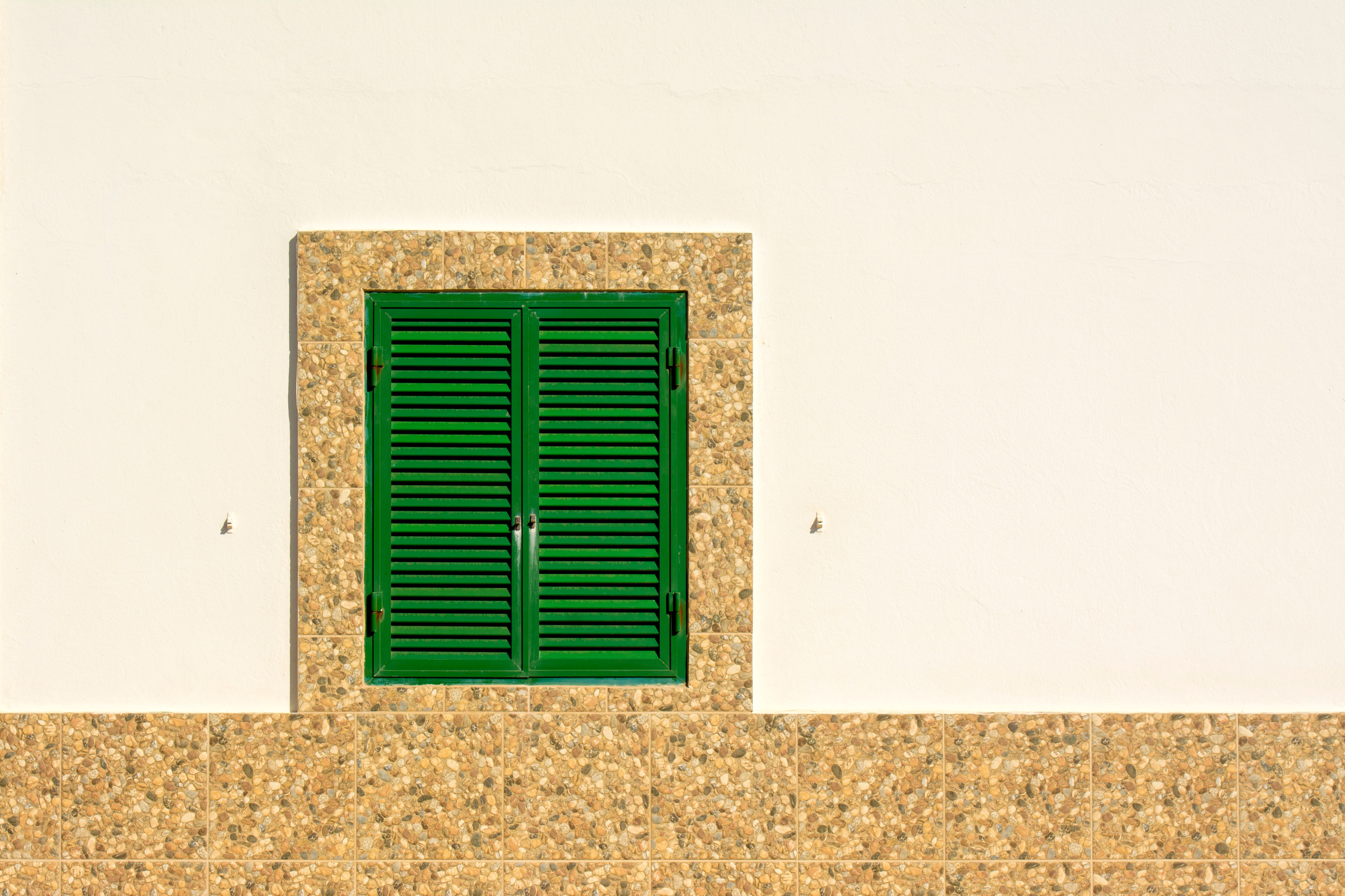 Closed Shutters on House Wall · Free Stock Photo