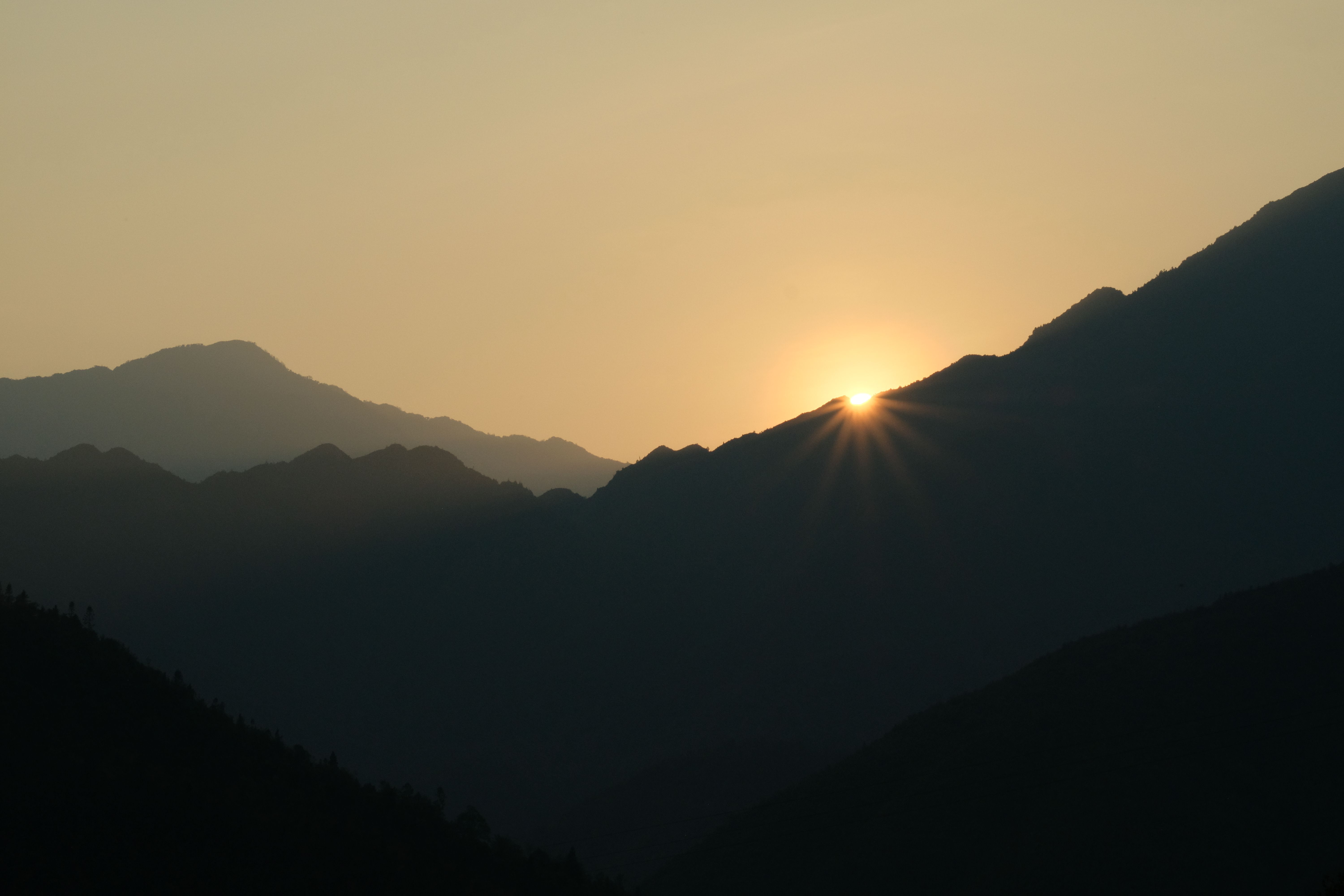 Sunset Sunlight over Hills Silhouette · Free Stock Photo