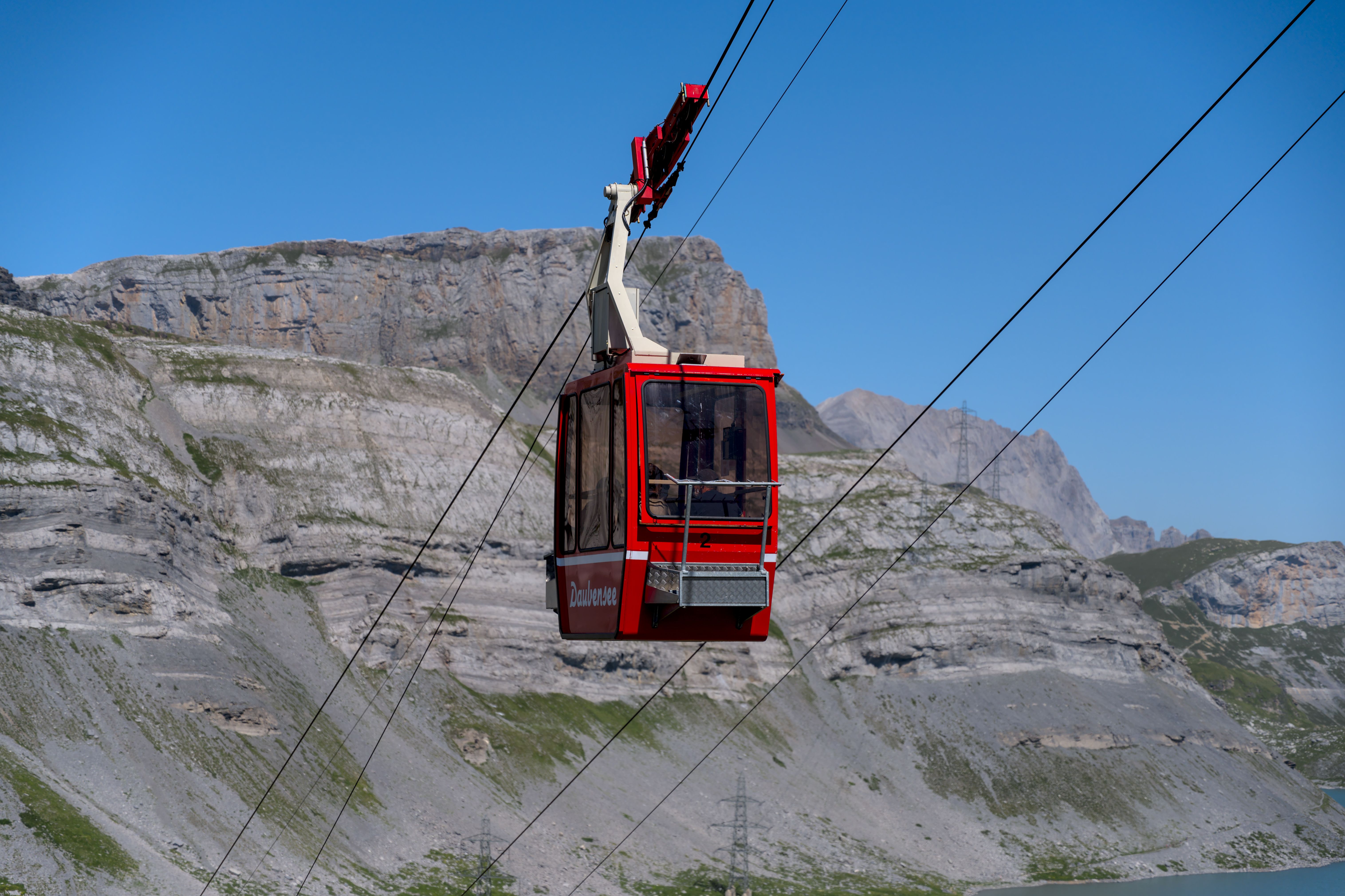 Gondola Lift Cabins Over the Forest on the Mountainside · Free Stock Photo