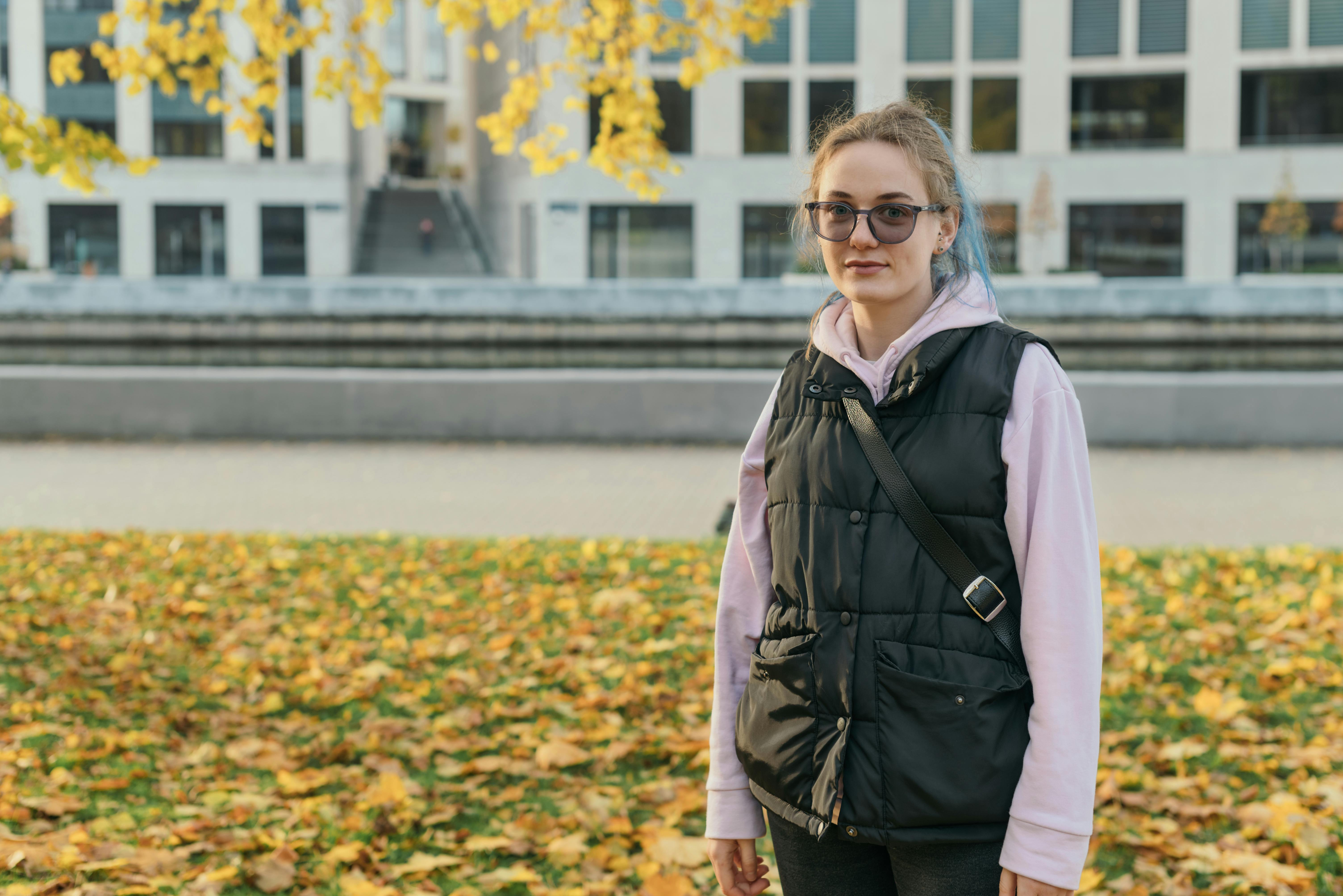 Student in Hoodie and Vest · Free Stock Photo