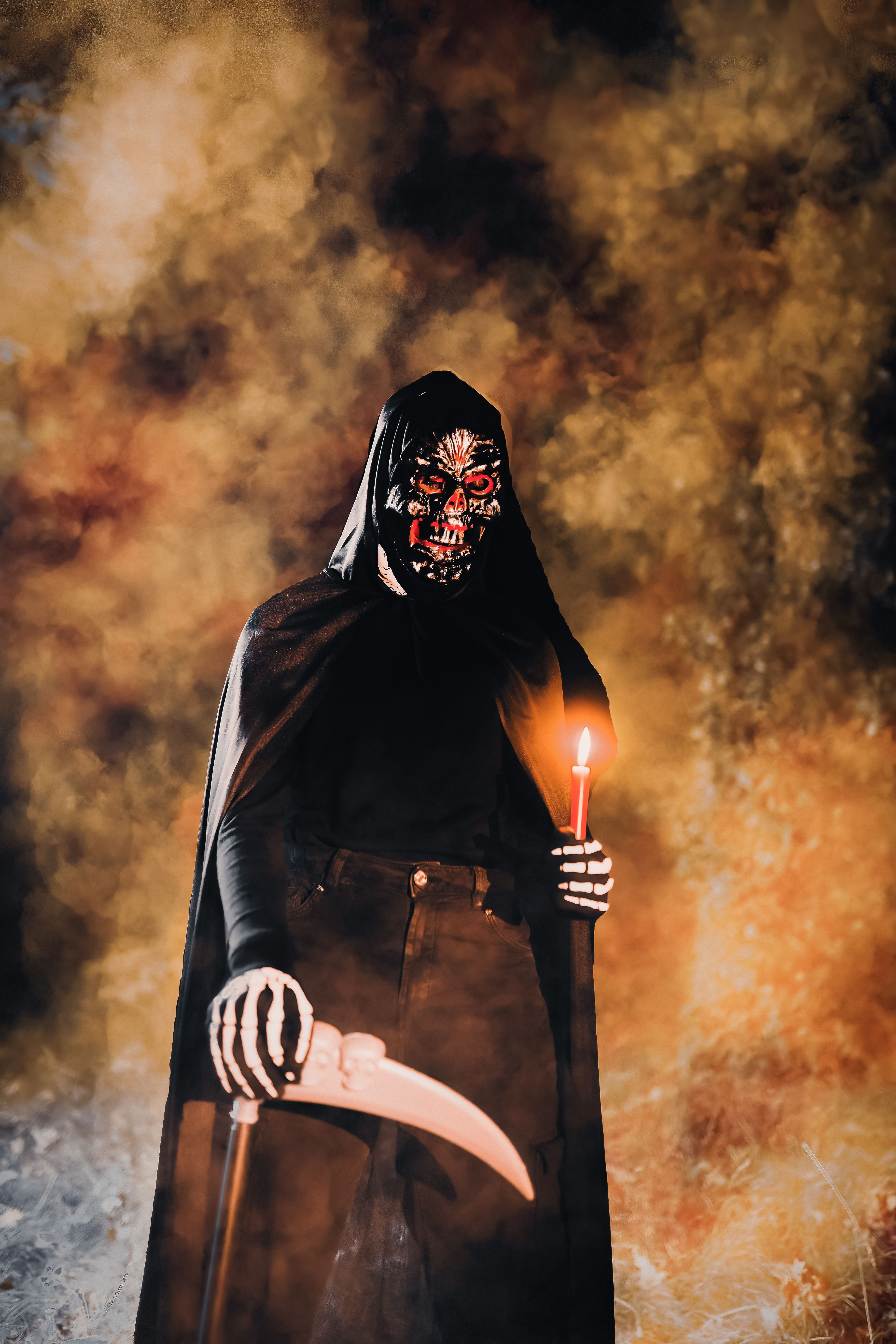 Person in Grim Reaper Costume Standing in Smoke · Free Stock Photo