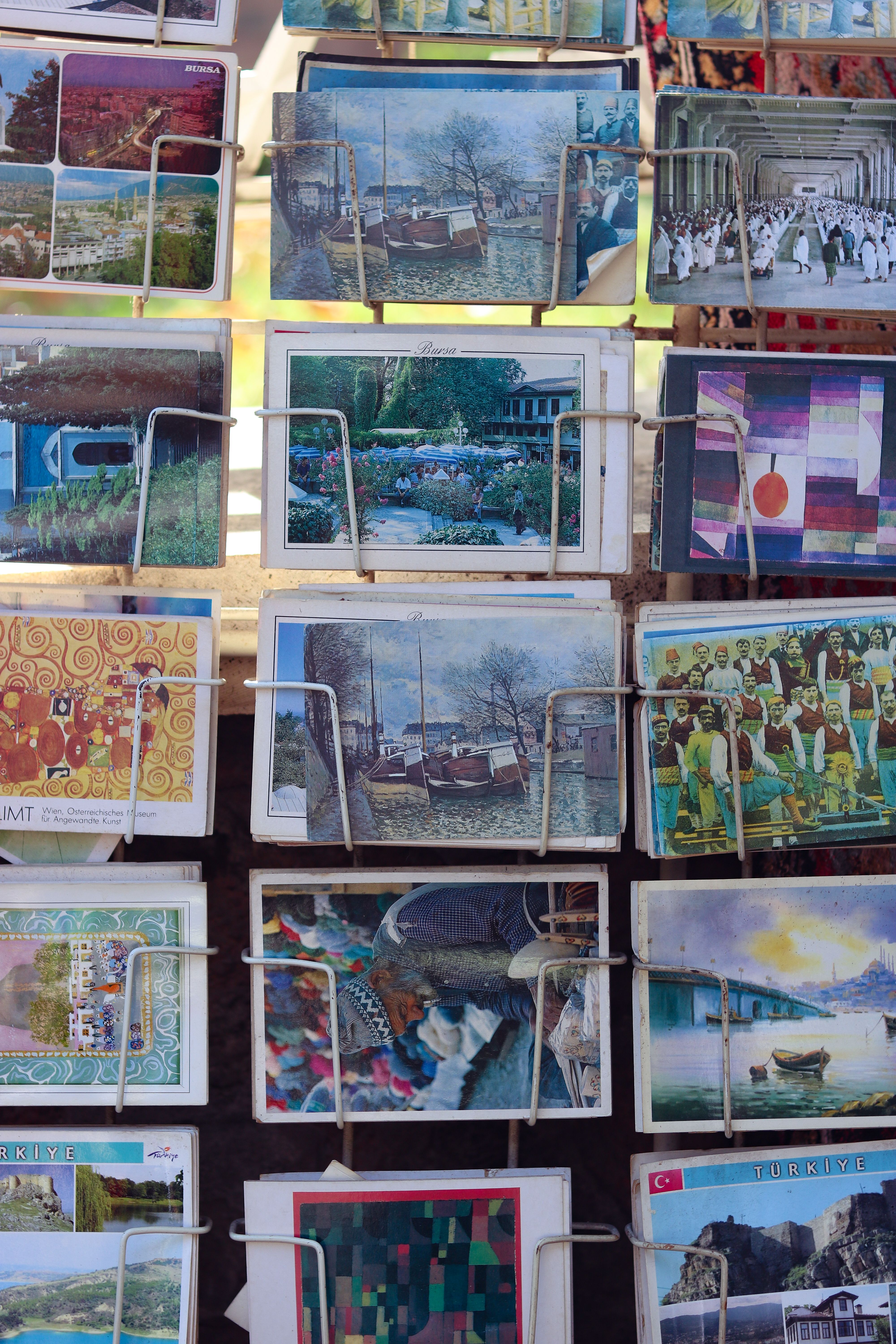 Postcards Displayed on the Rack · Free Stock Photo