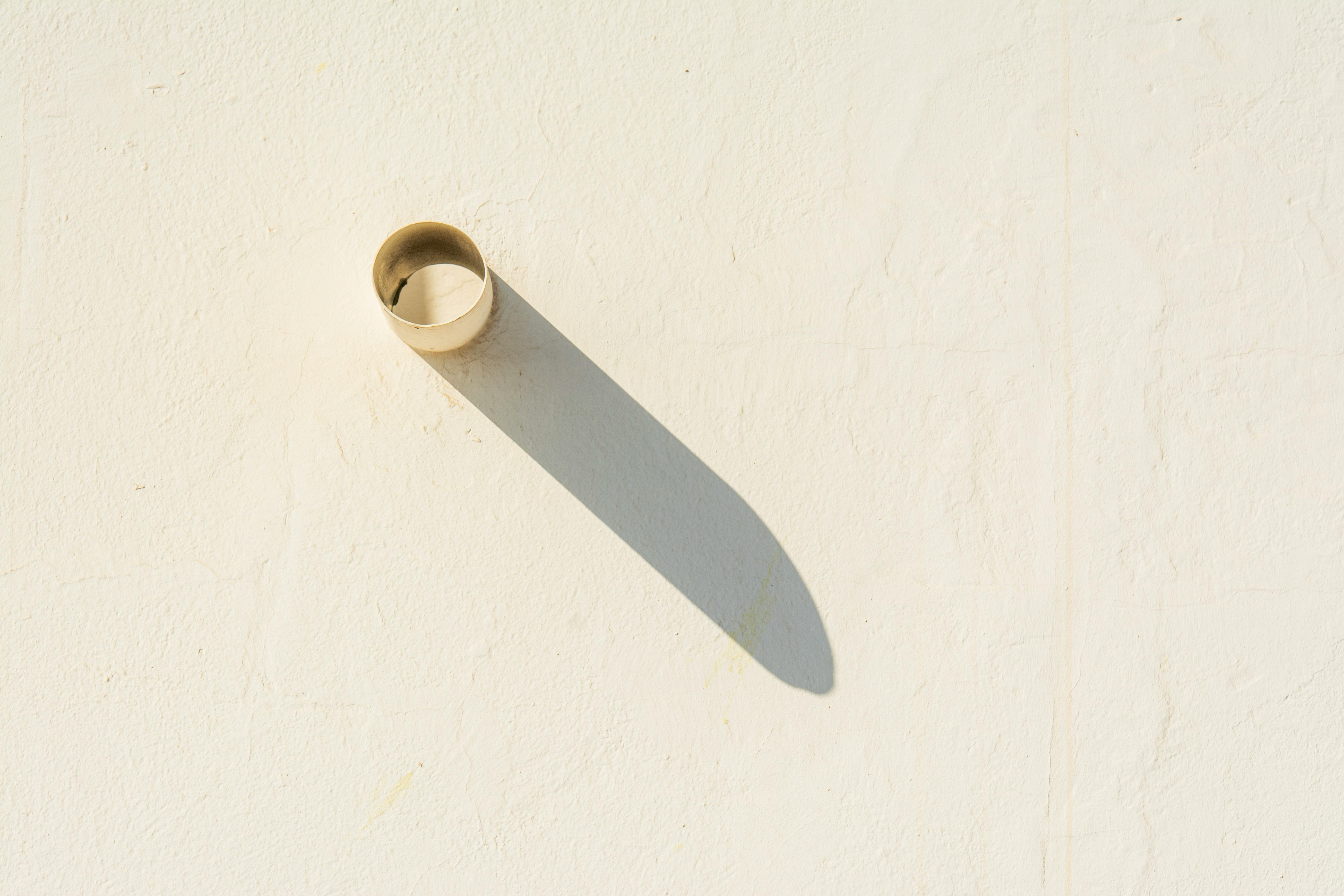 Woman Crouching in Sunlit and Looking Up · Free Stock Photo