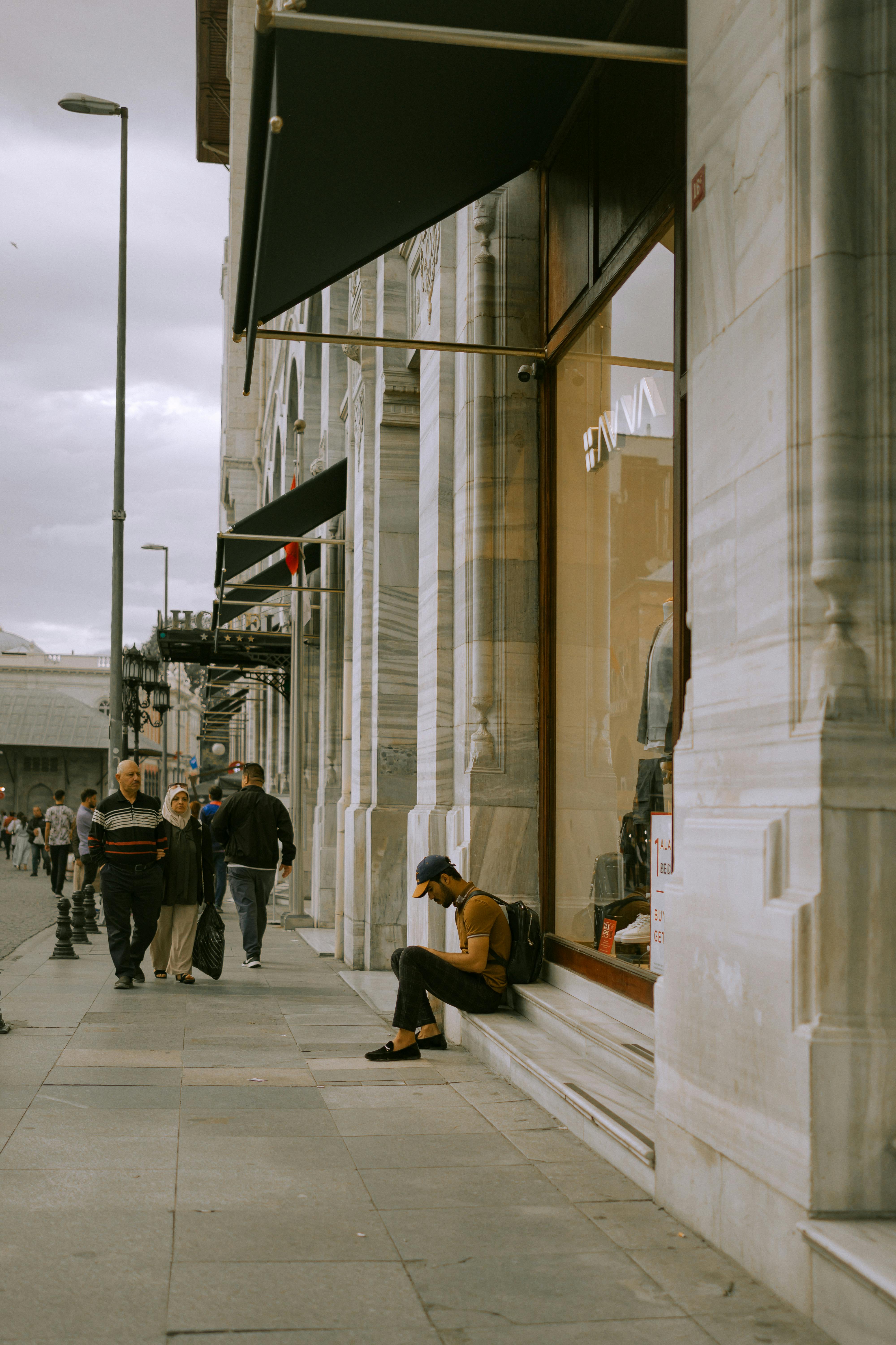 Sidewalk along the Building with Shops in City · Free Stock Photo