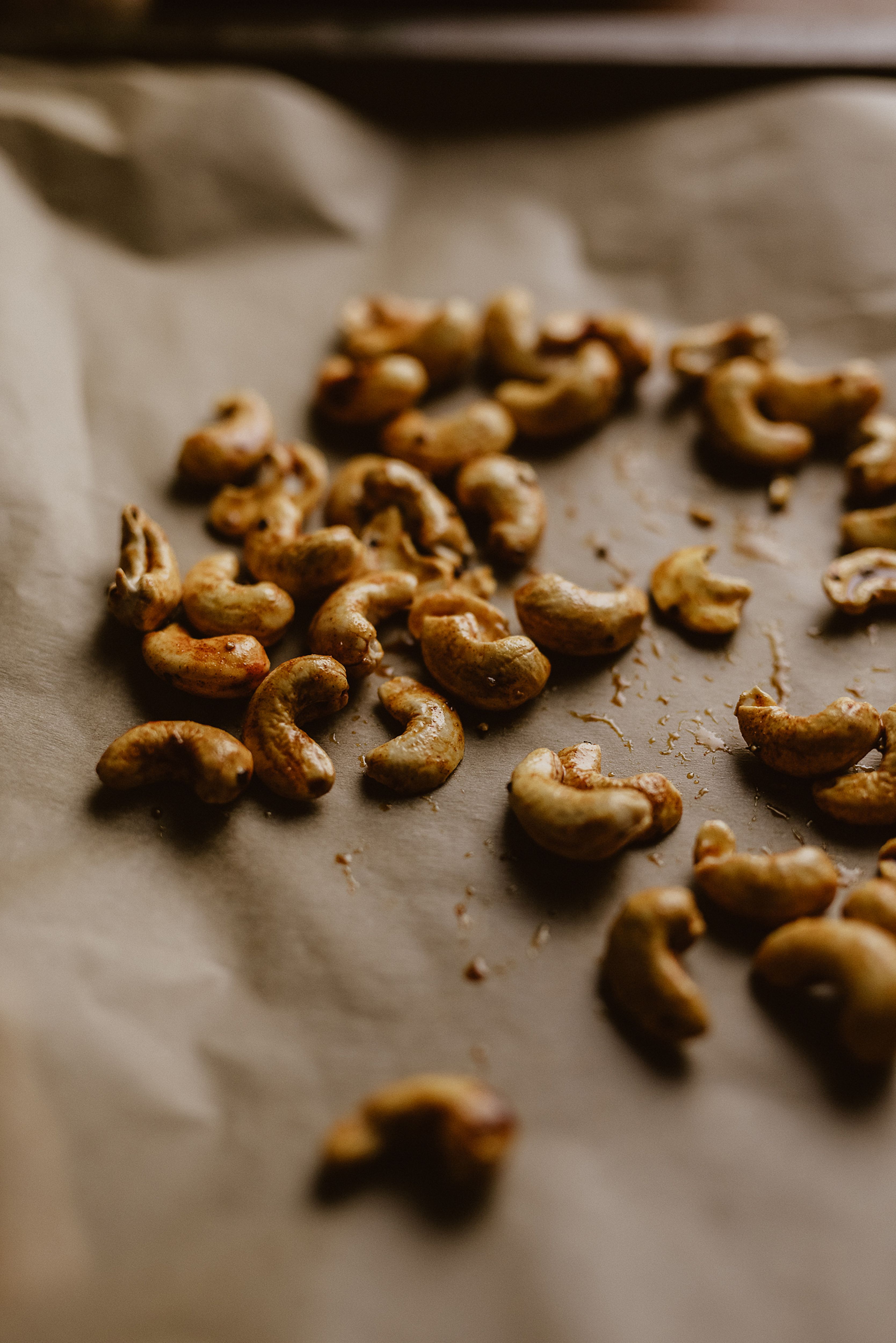 Honey Roasted Cashew Nuts on Baking Paper · Free Stock Photo
