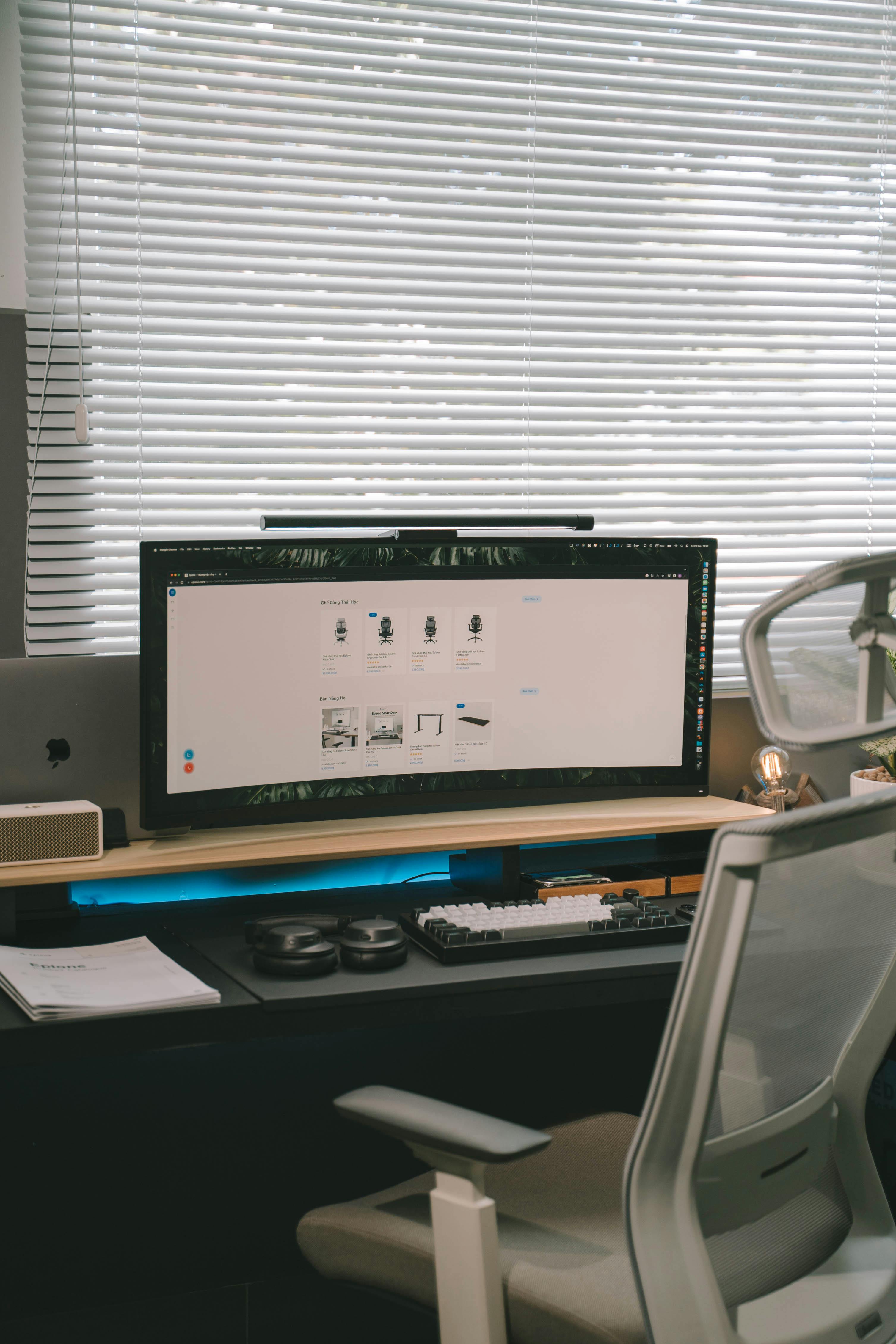 Computer Screen on a Desk in an Office · Free Stock Photo