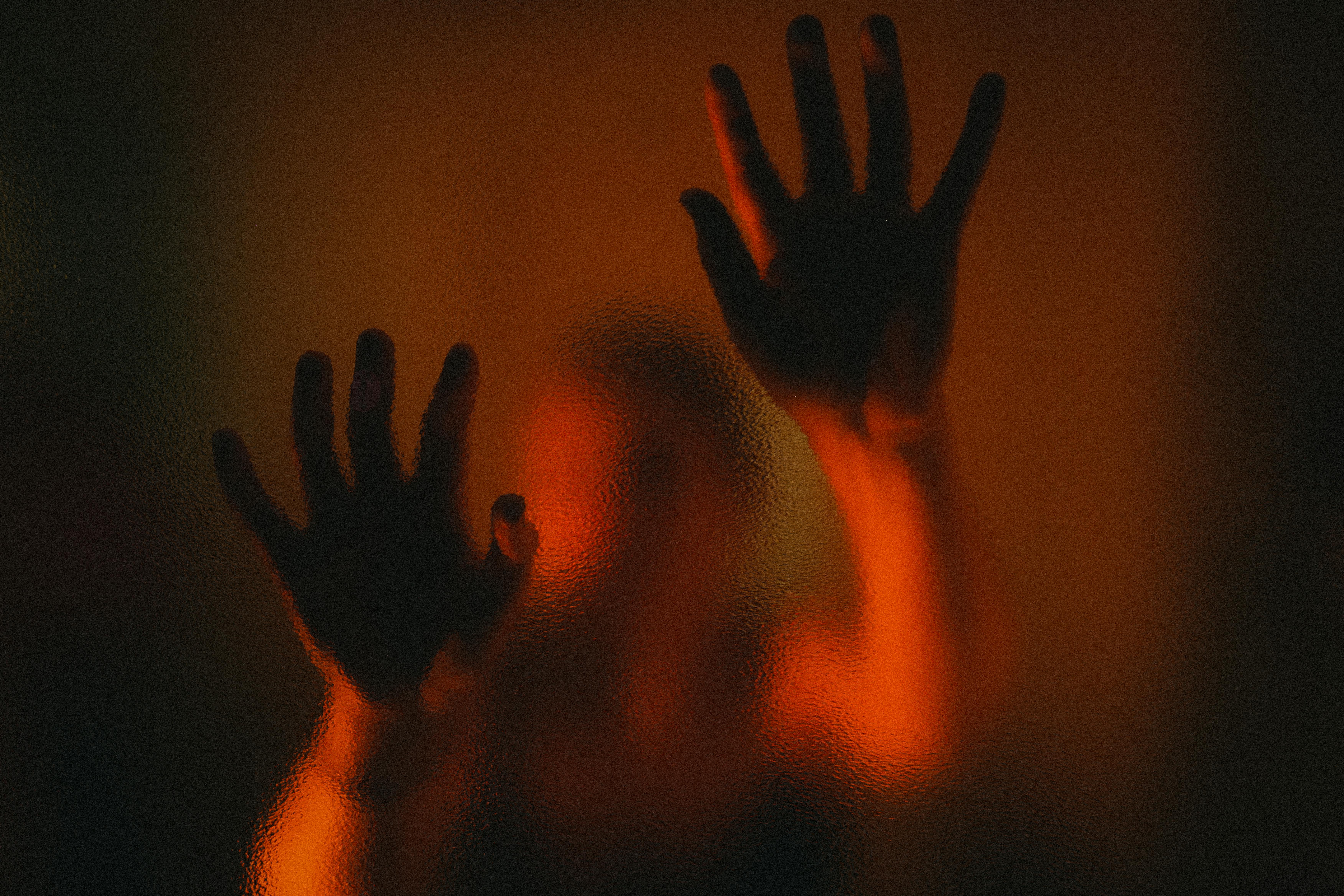 Red Cinematic Lighting - Hands touch · Free Stock Photo