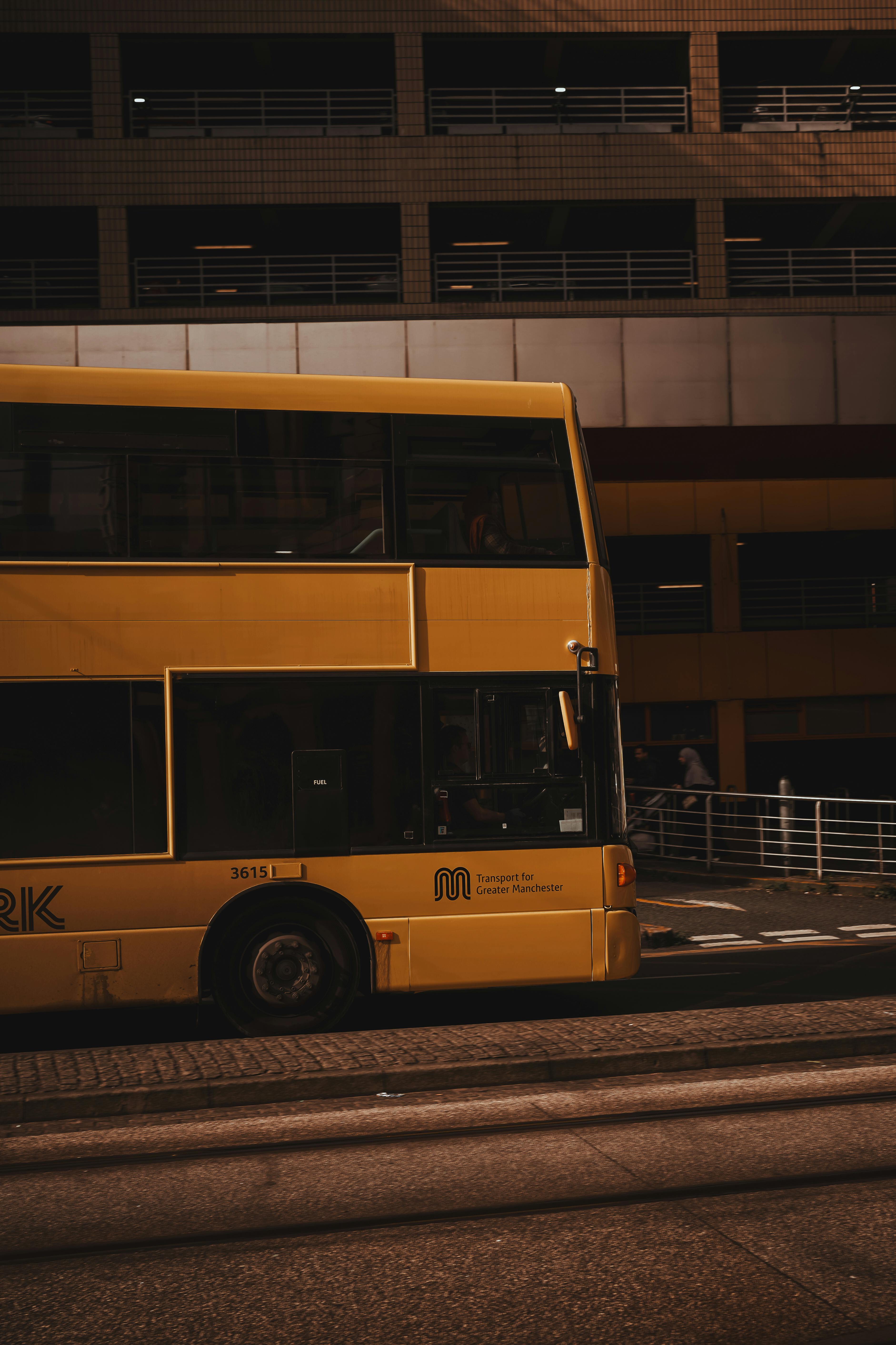 A Yellow Double-Decker Bus on a Street in City · Free Stock Photo