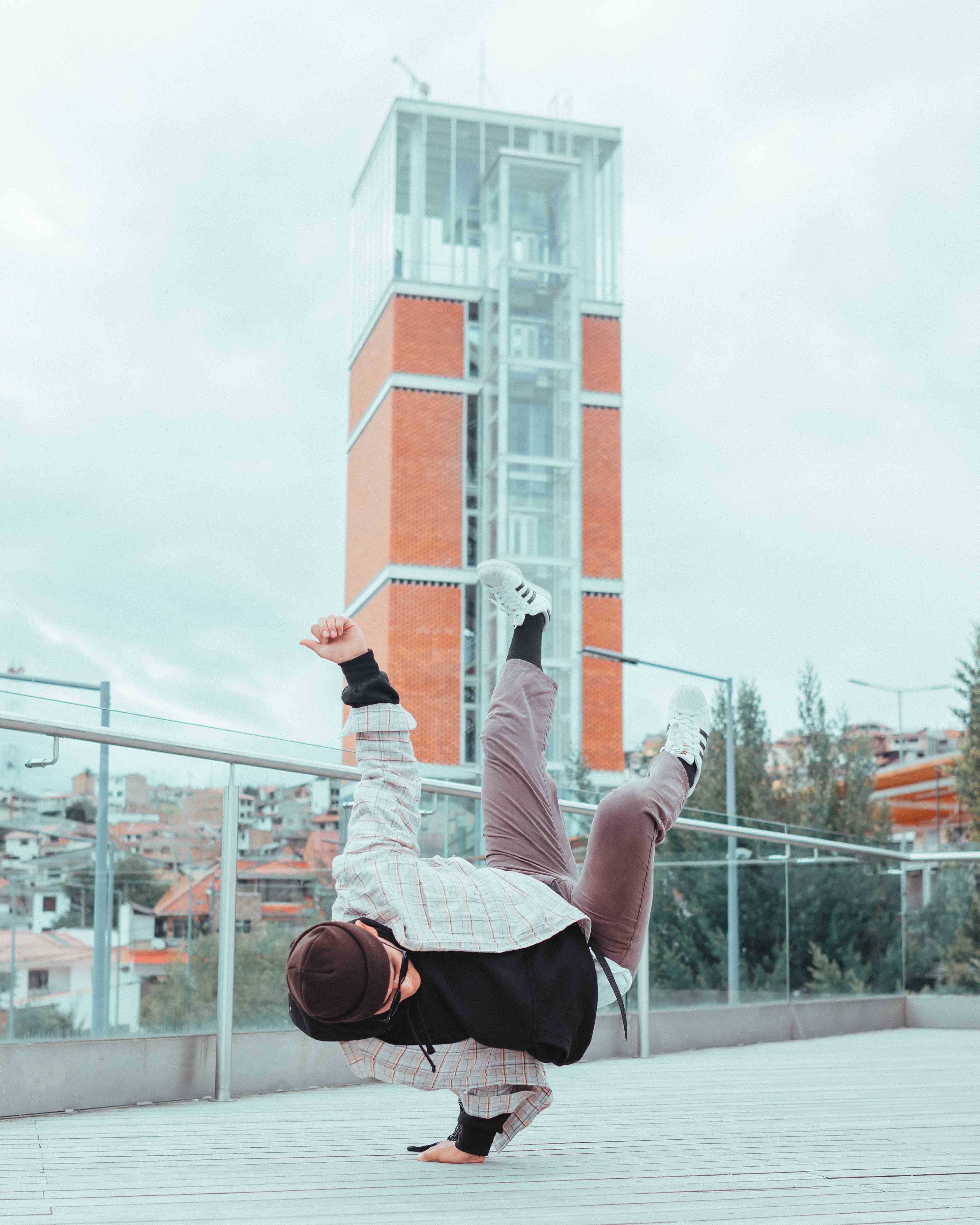 Man Breakdancing on Pavement · Free Stock Photo
