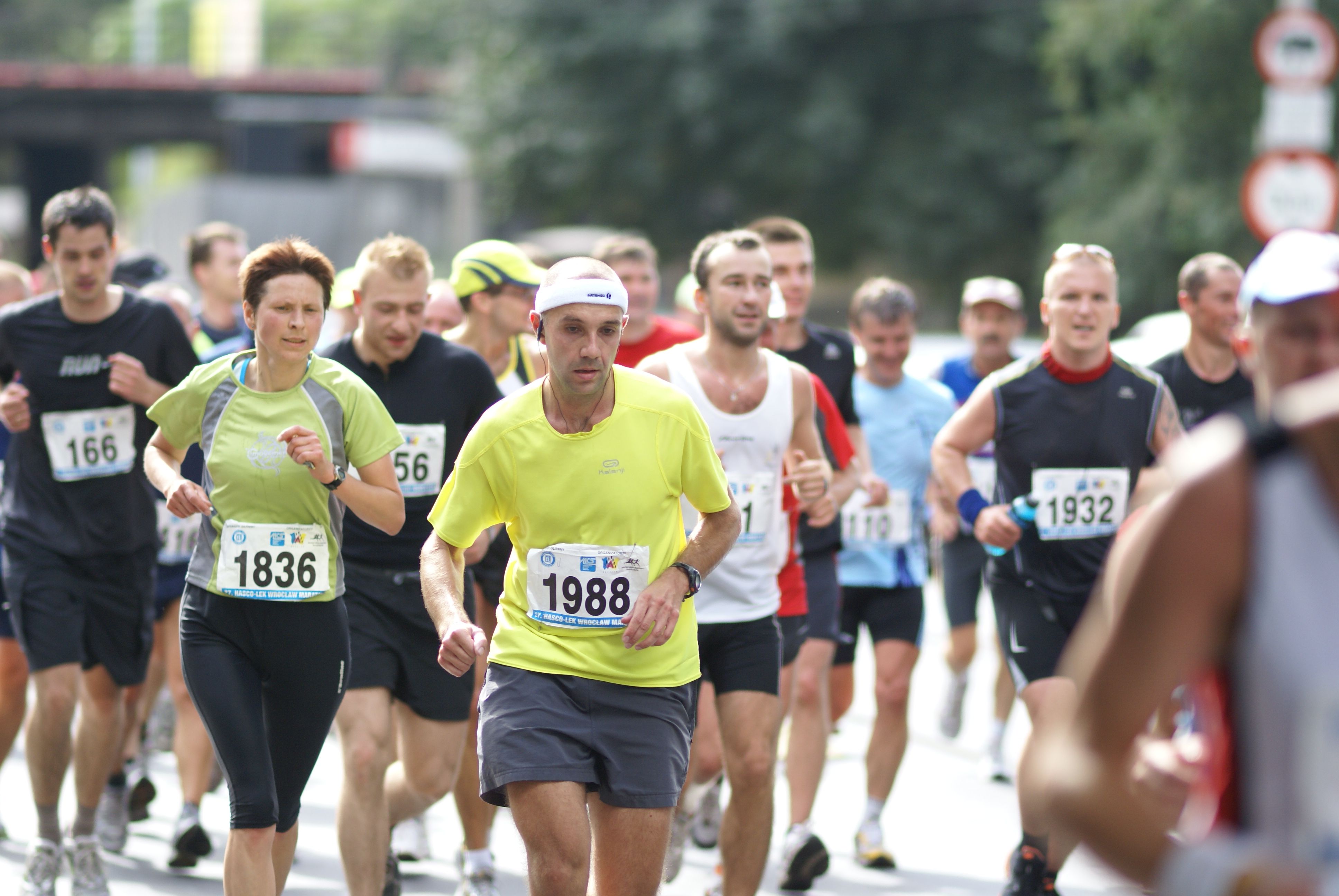 A group of people running in a marathon · Free Stock Photo