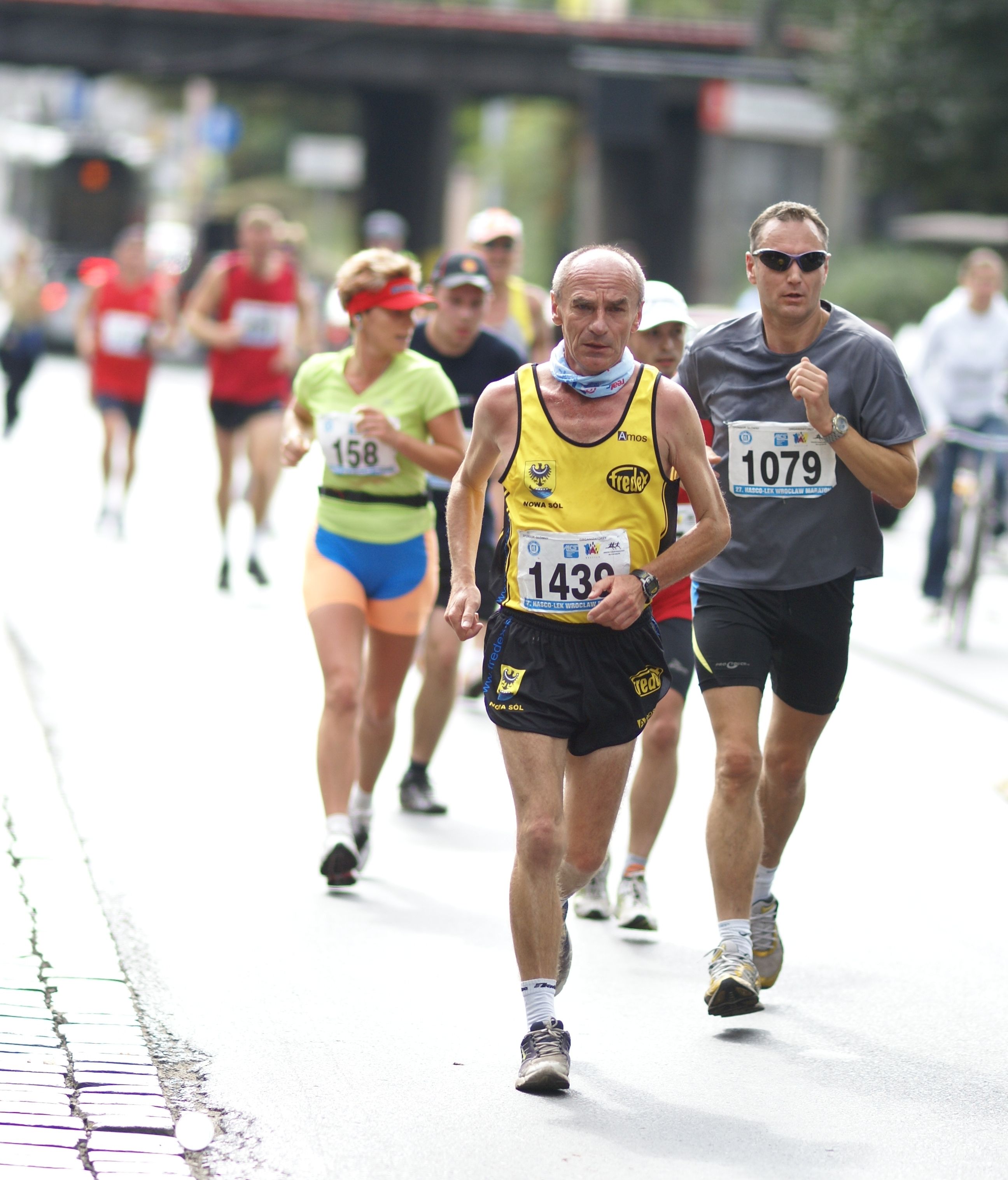 A group of people running in a marathon · Free Stock Photo