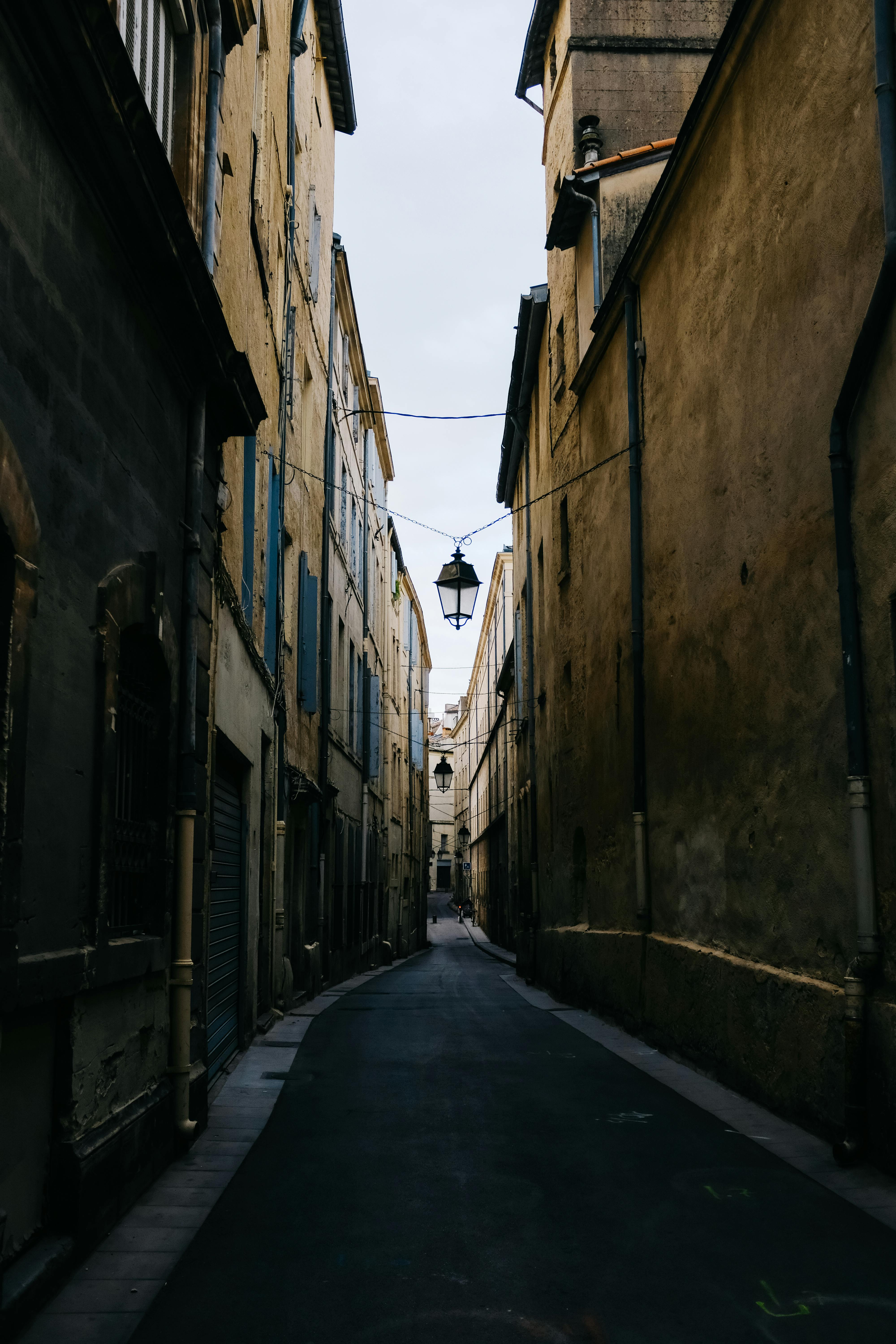 Narrow, Cobblestone Street in Shadow · Free Stock Photo