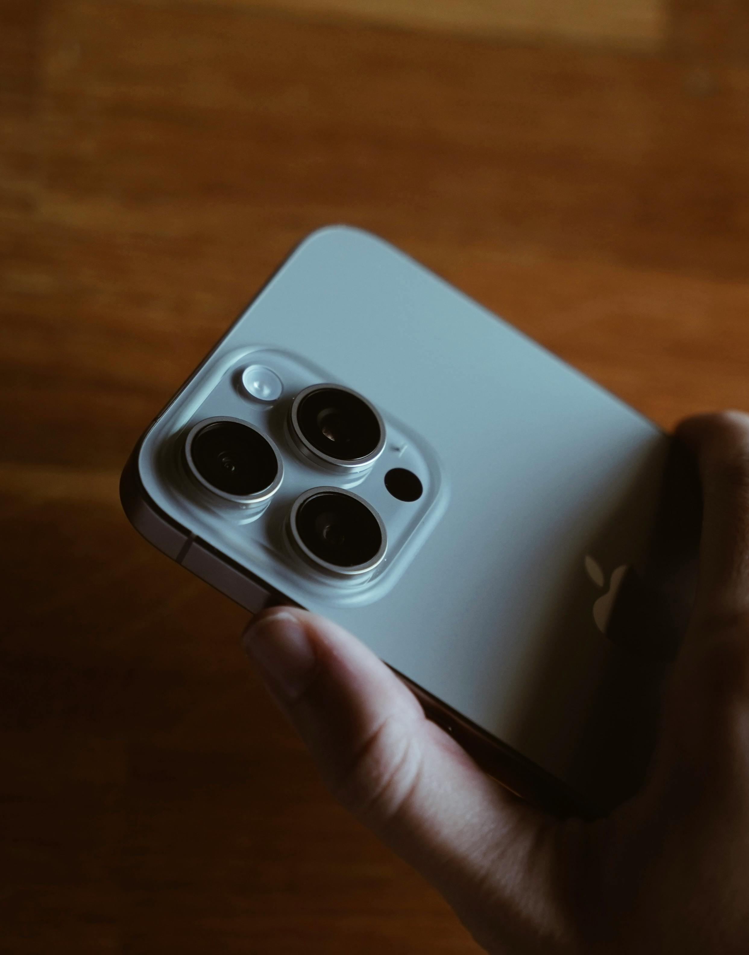 Close-up of a Person Holding an iPhone 15 Pro · Free Stock Photo