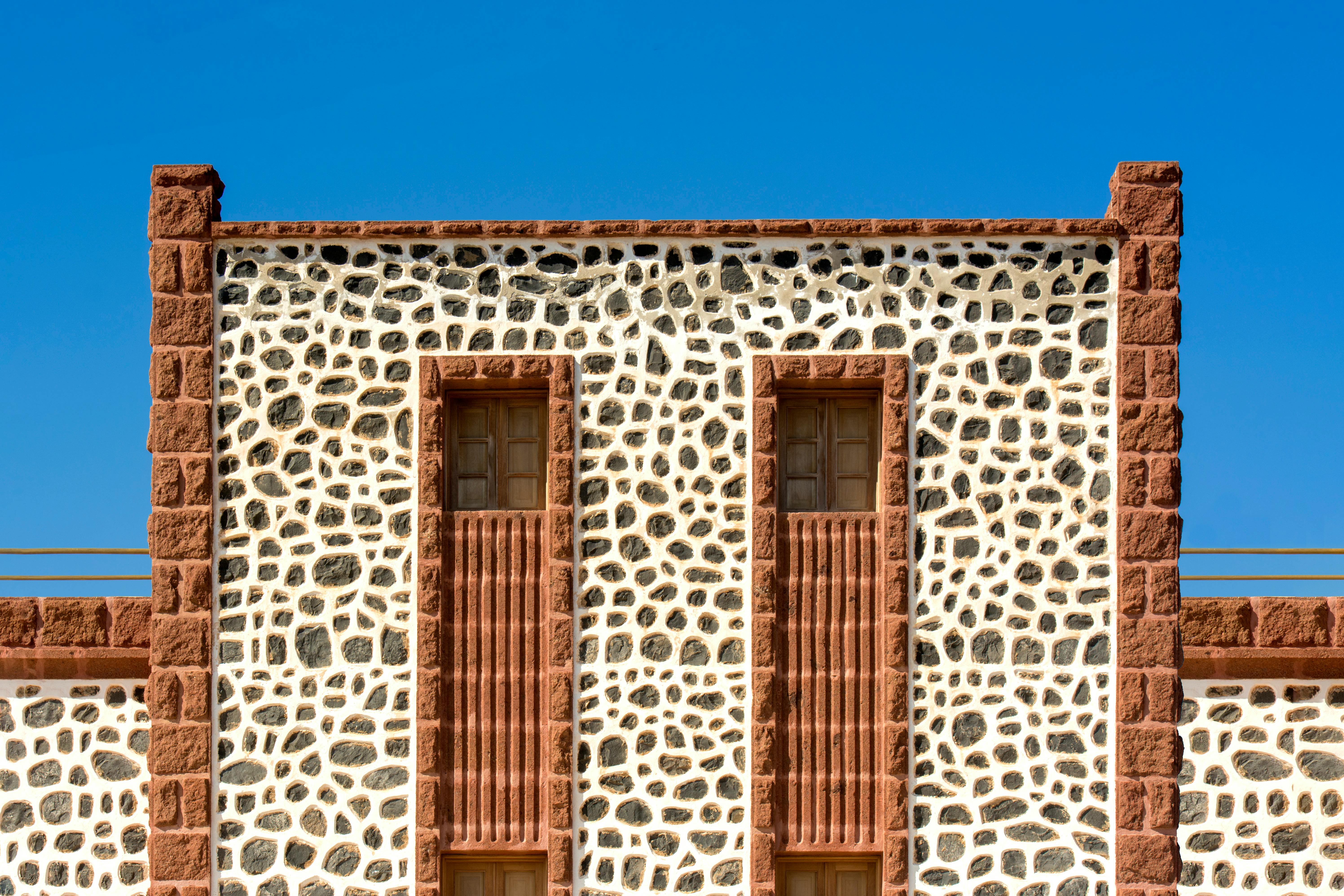 Vintage Stone Building with Pattern on Wall · Free Stock Photo