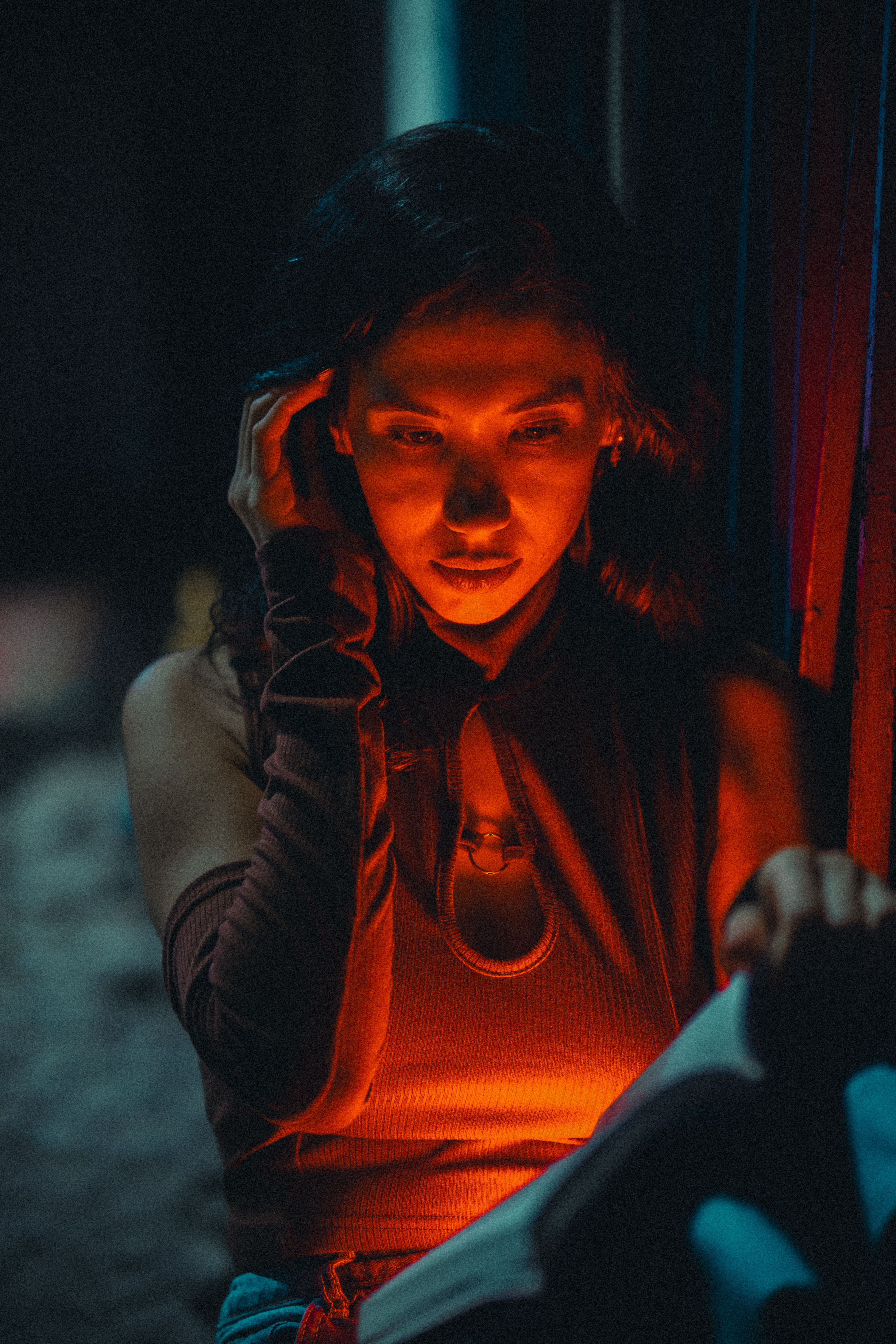 Red Light on Woman Sitting at Night · Free Stock Photo