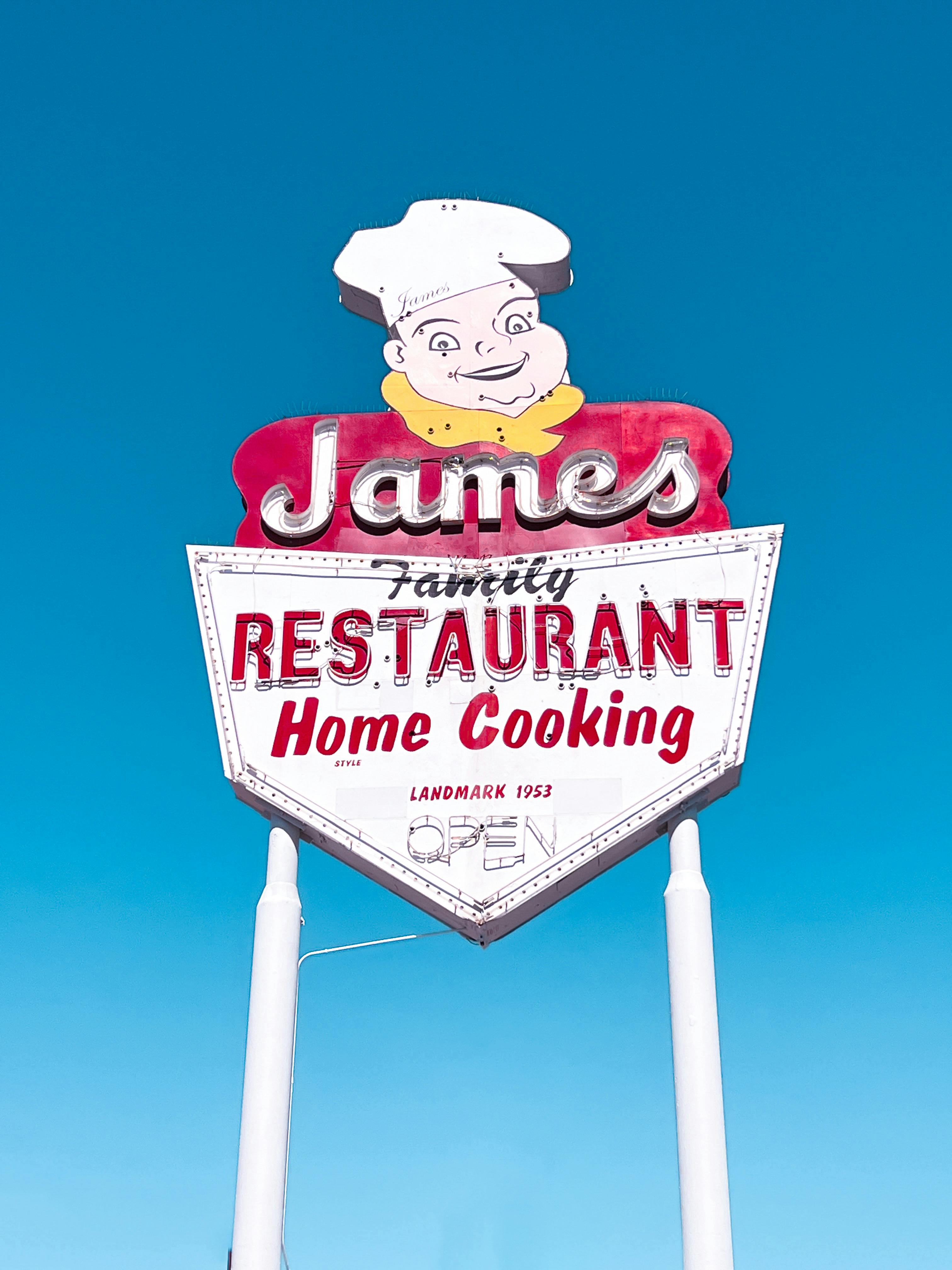The Sign of the James Restaurant against Clear, Blue Sky · Free Stock Photo