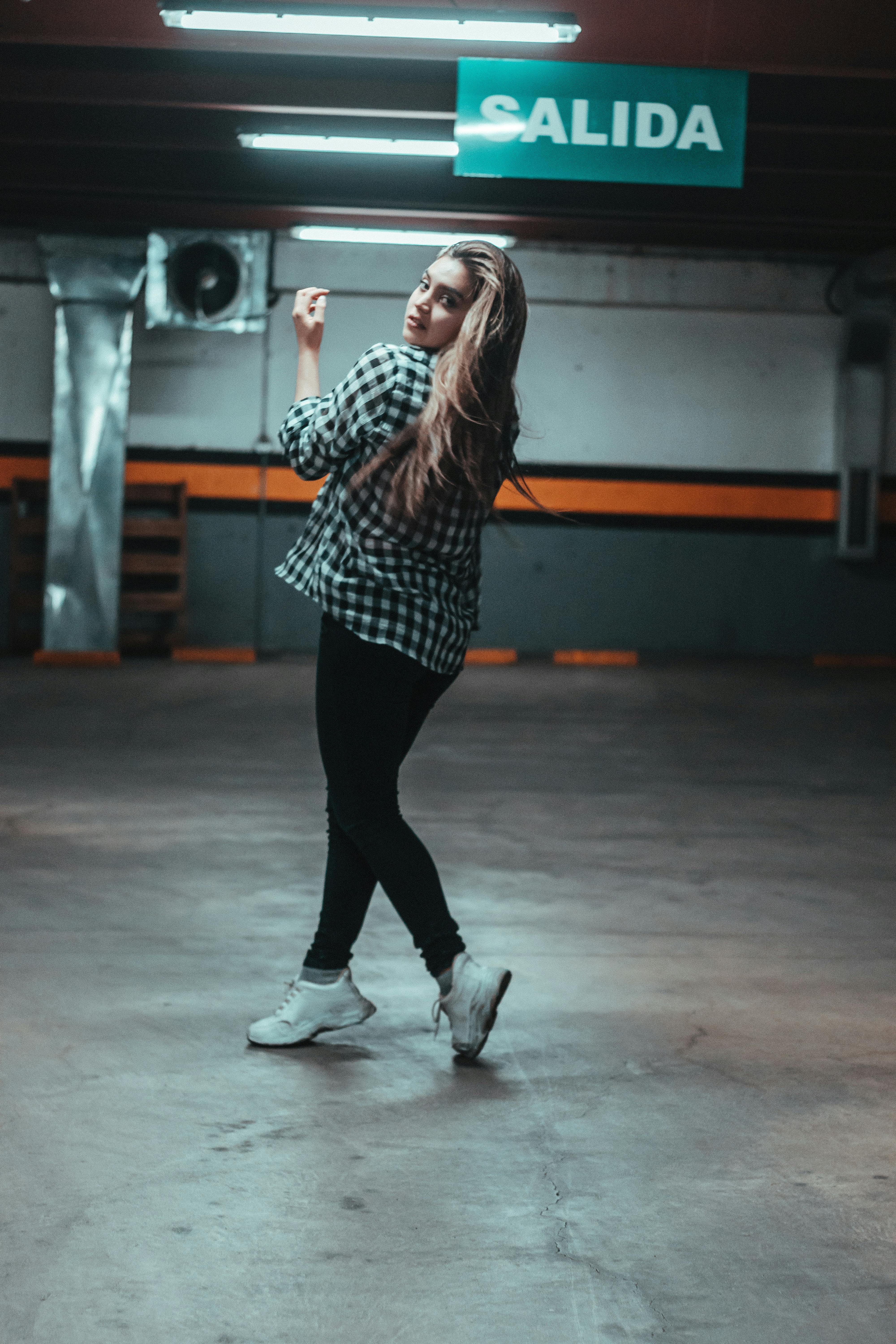 Woman in Check Shirt Dancing · Free Stock Photo