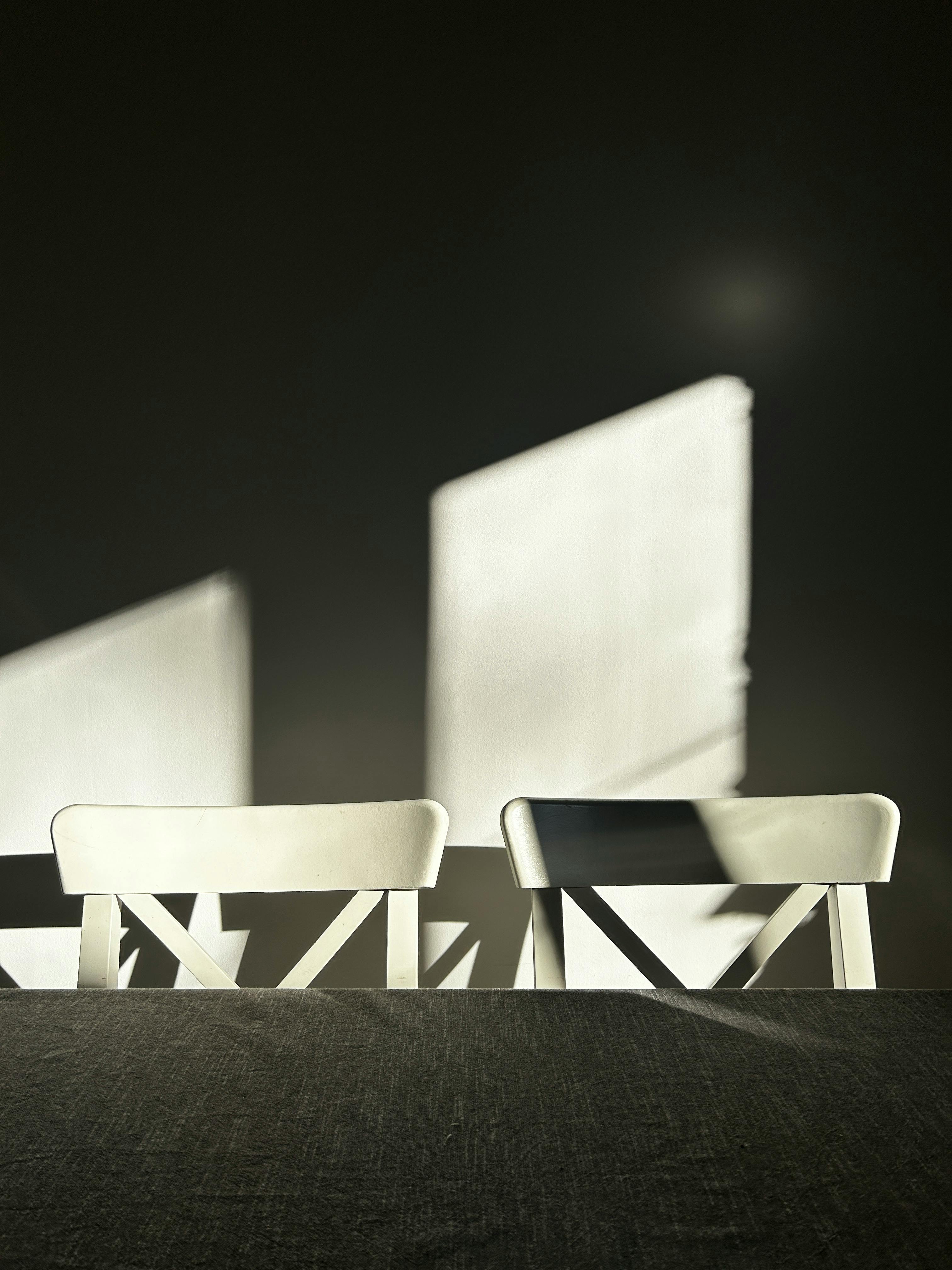 Empty Chair in Light in Room in Shadow · Free Stock Photo