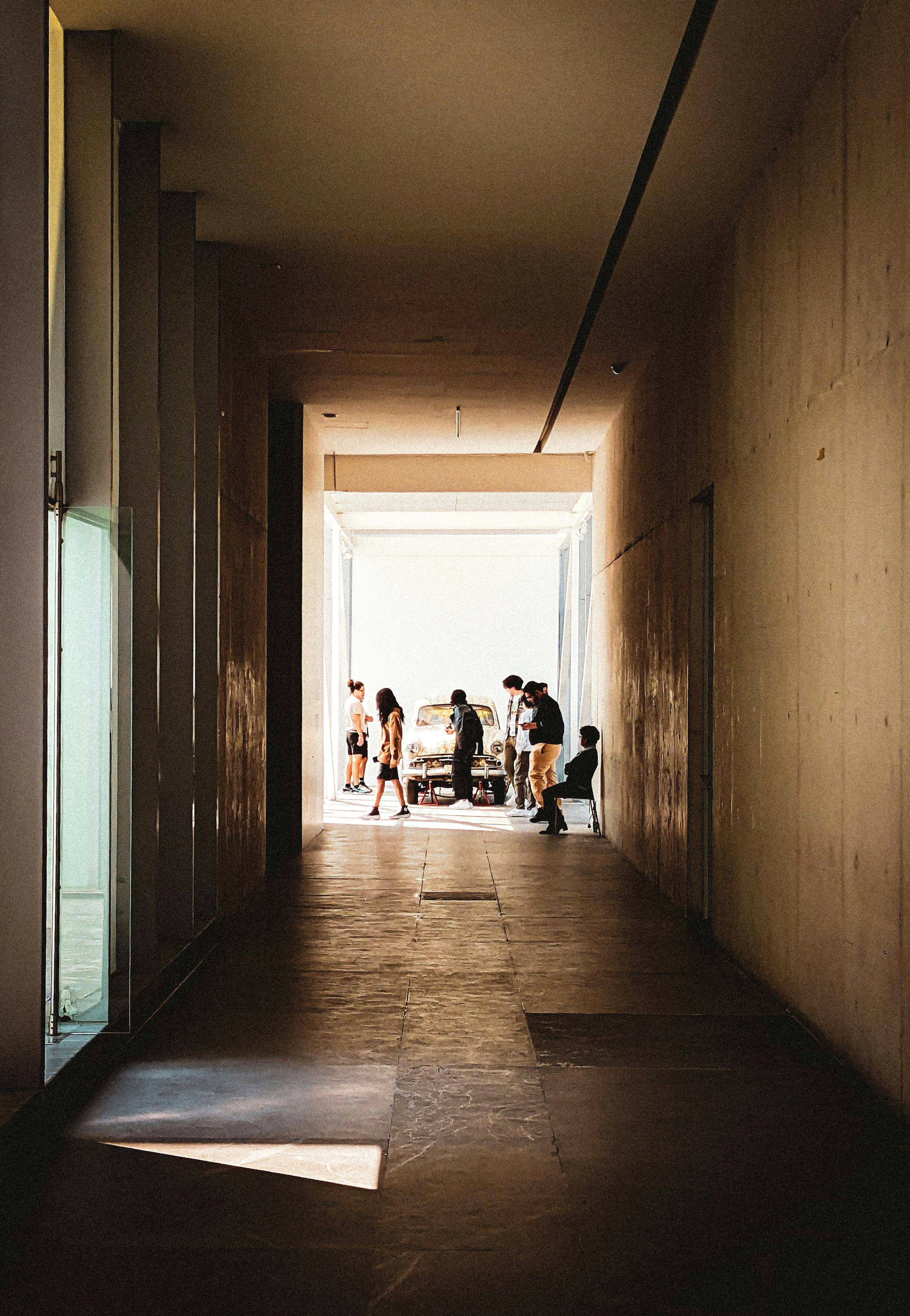 Corridor in Shadow and People behind · Free Stock Photo