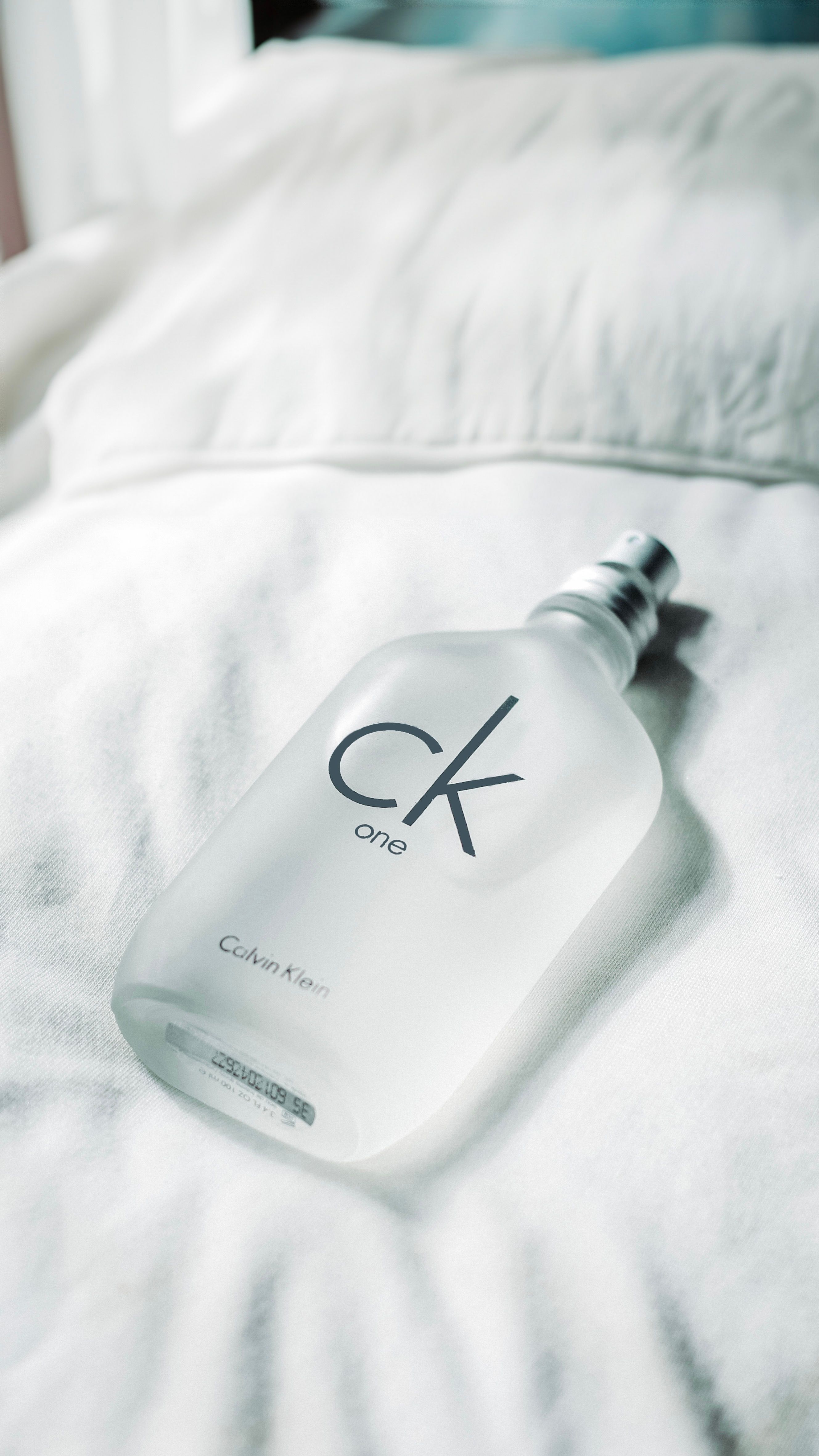 Bottle of Perfume on Bed · Free Stock Photo