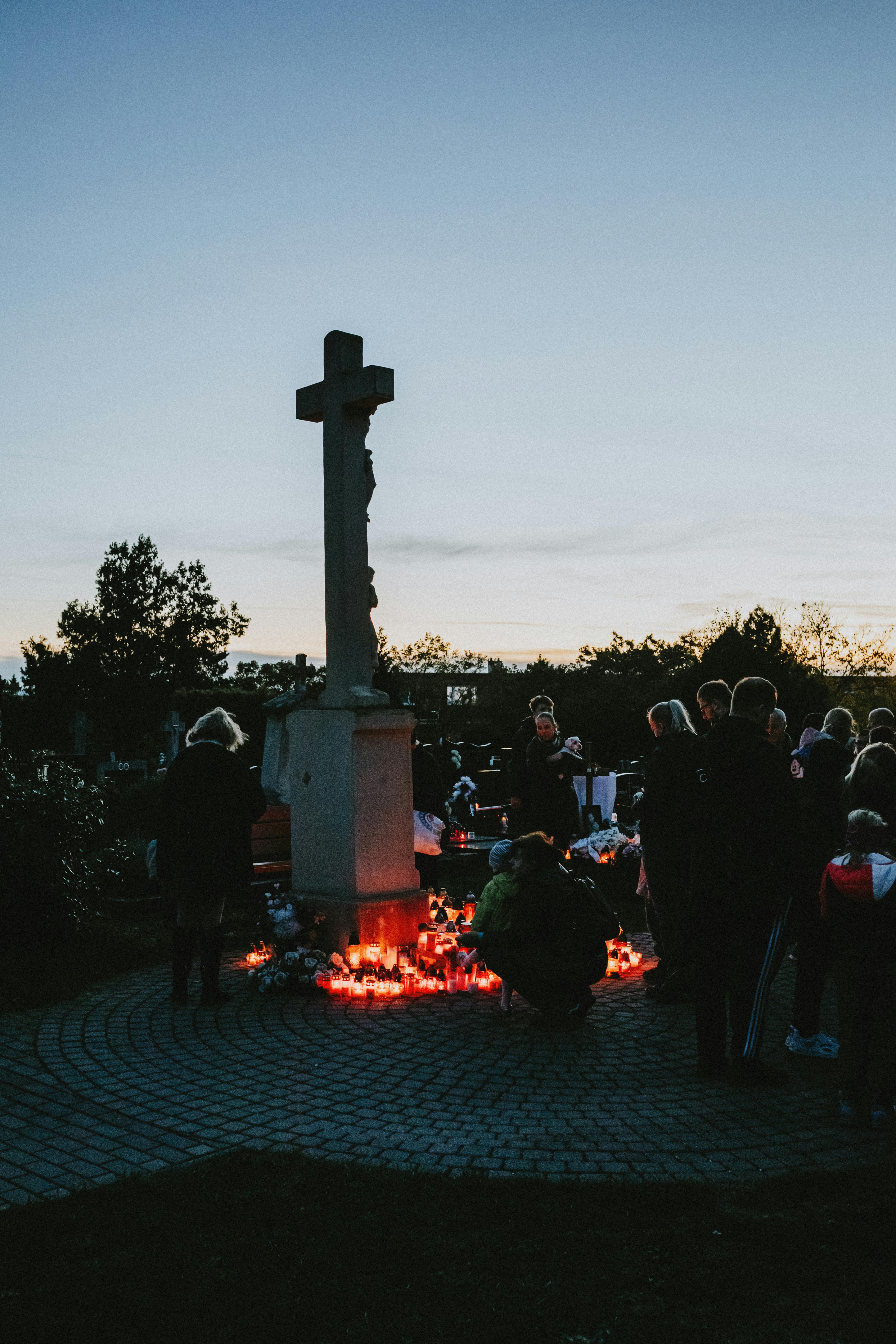 Crowd Around Cross in Cemetery · Free Stock Photo