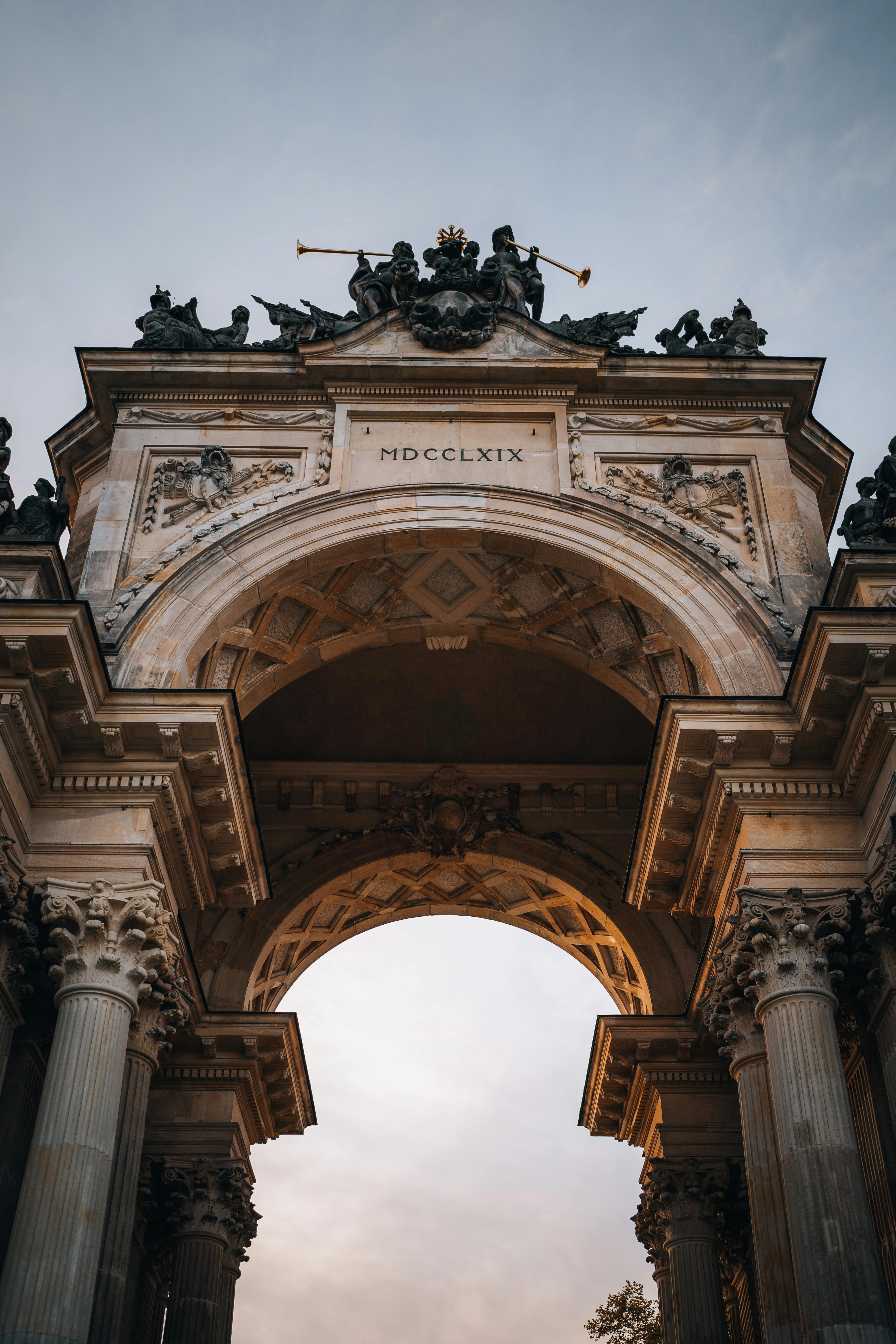 Low Angle Shot of a Neoclassical Gate · Free Stock Photo