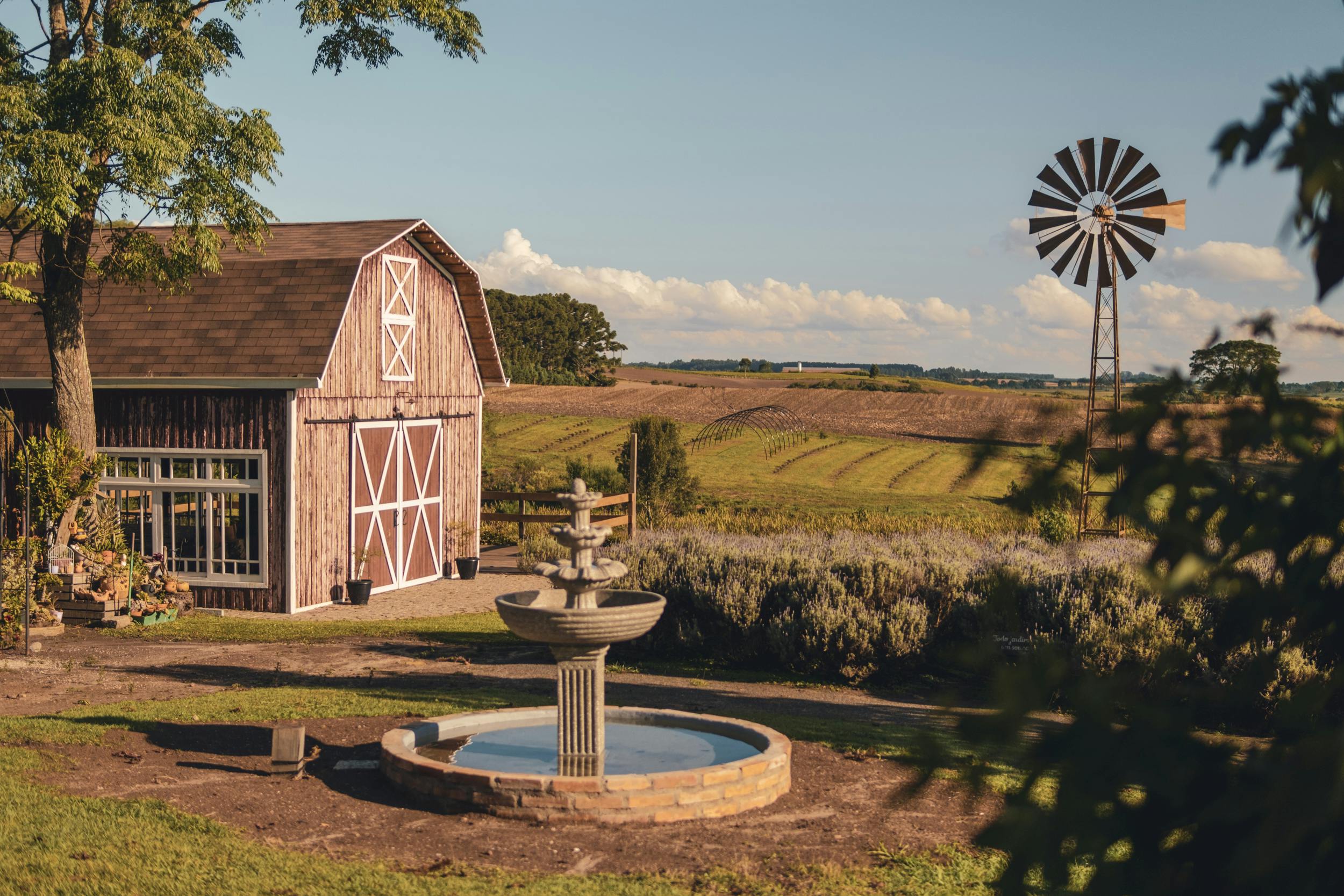 Brown Grey Barn House Near Windmill during Daytime · Free Stock Photo
