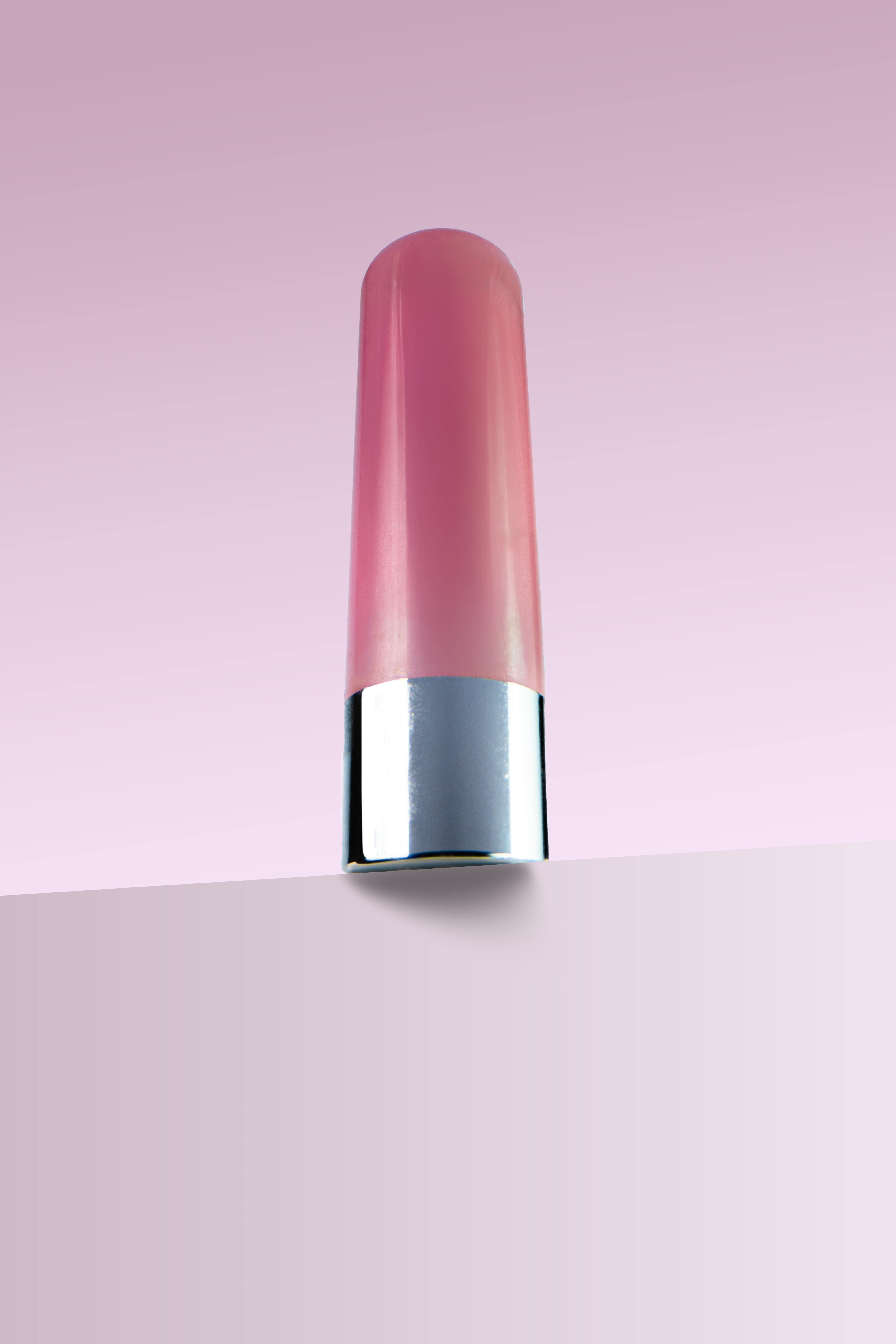 A Red Lipstick and a Print of a Kiss on Paper · Free Stock Photo