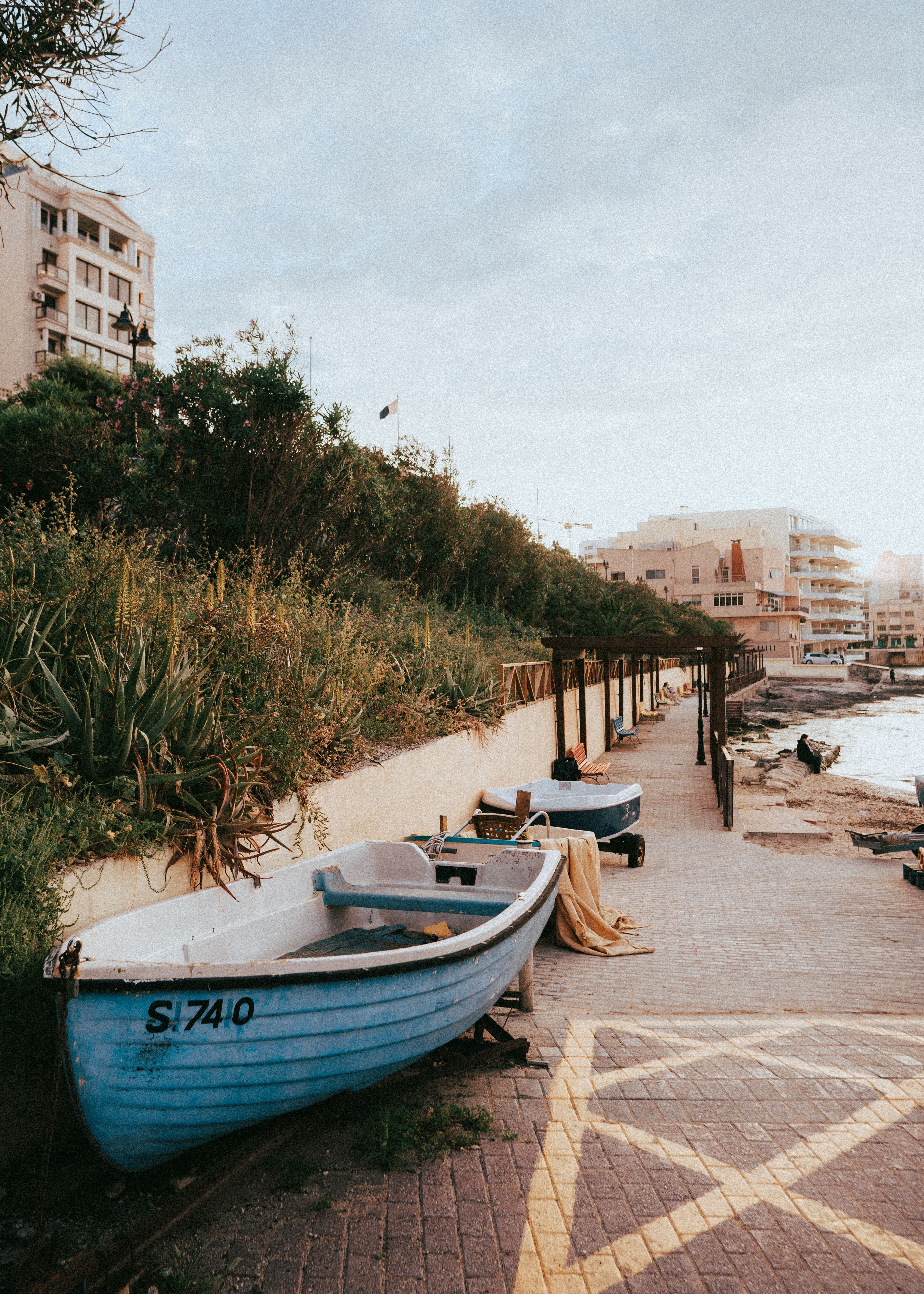 Boat on Promenade on Sea Shore · Free Stock Photo