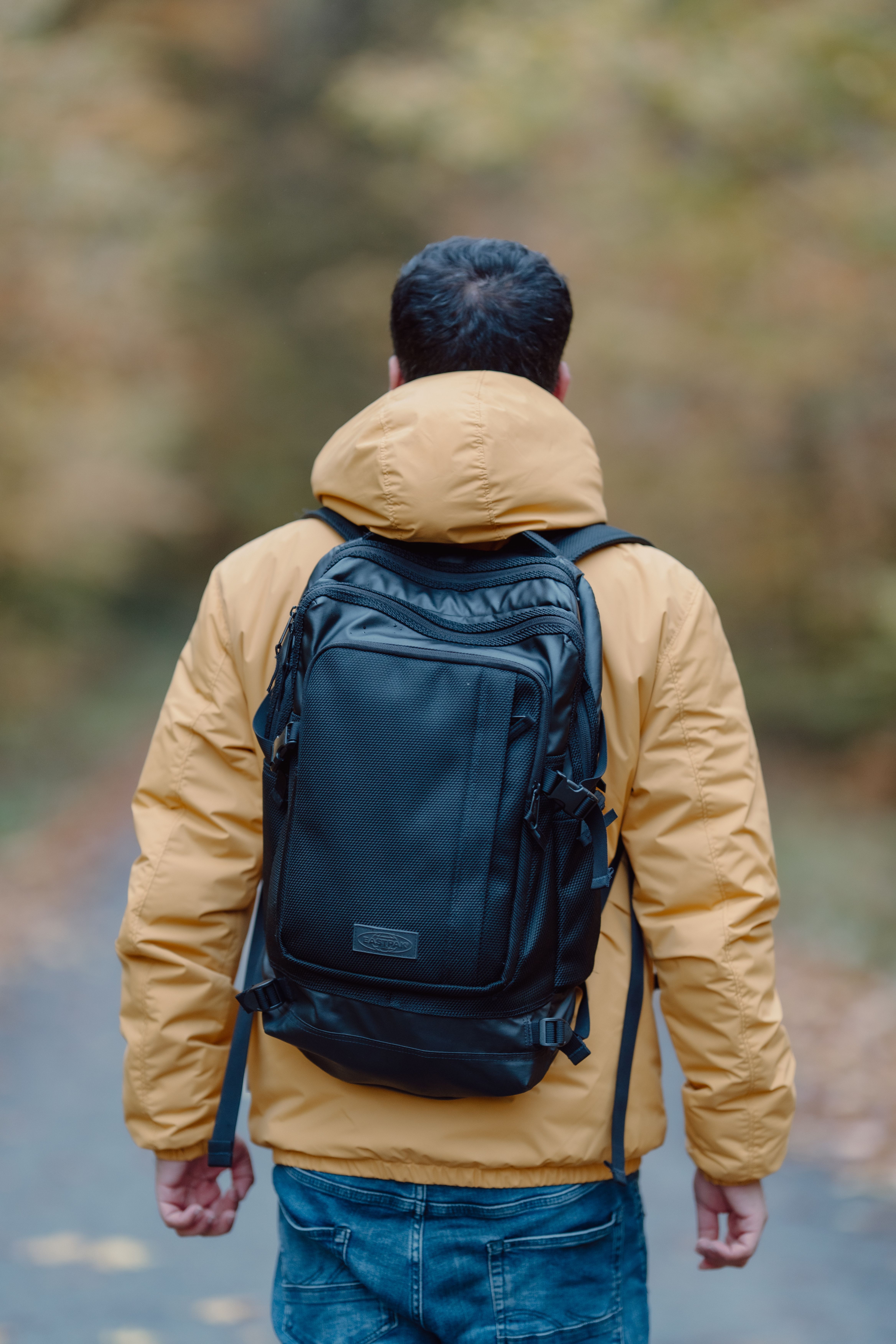 Back View of a Man in a Jacket Wearing a Backpack · Free Stock Photo