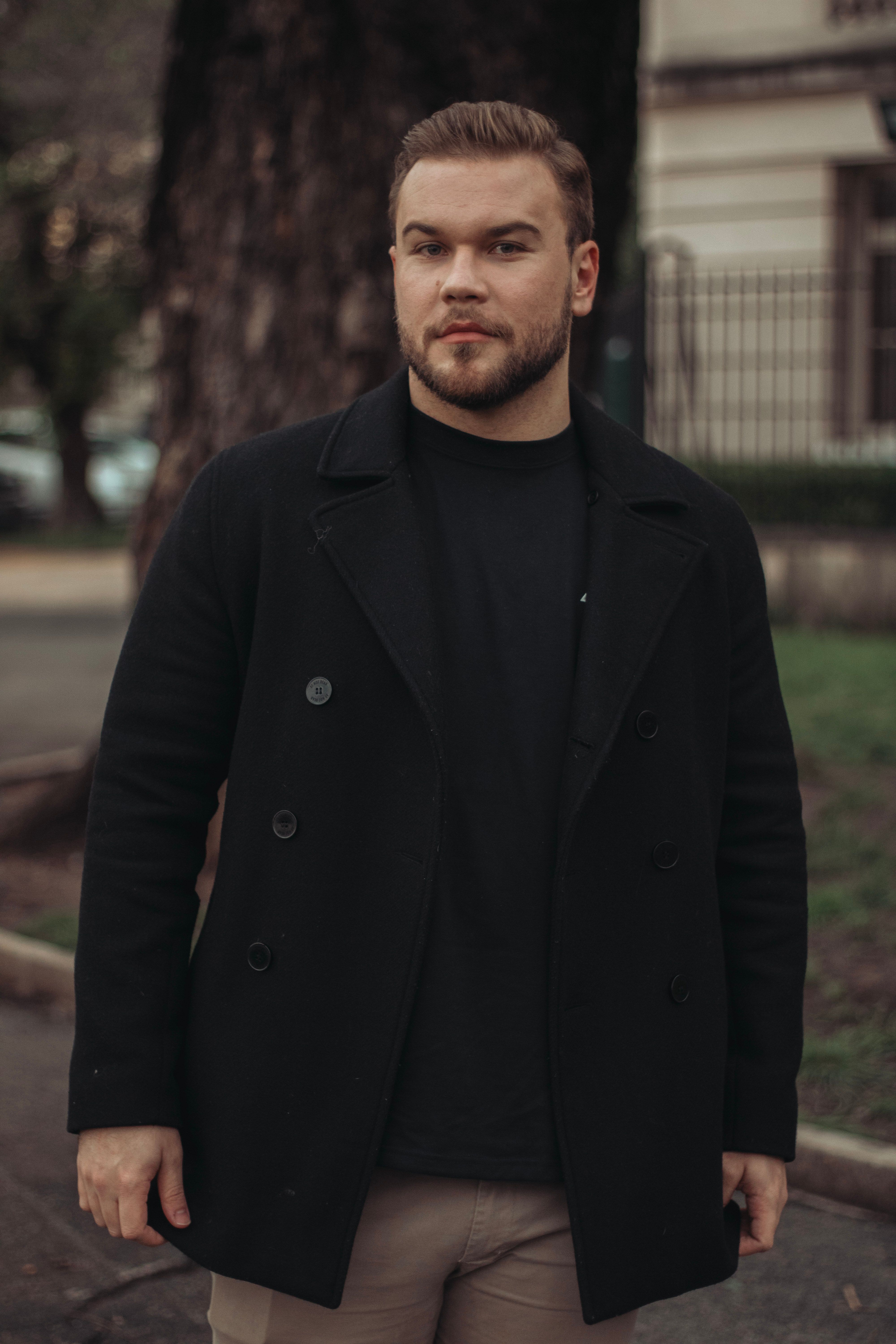 Model in Short Black Coat on the Sidewalk · Free Stock Photo
