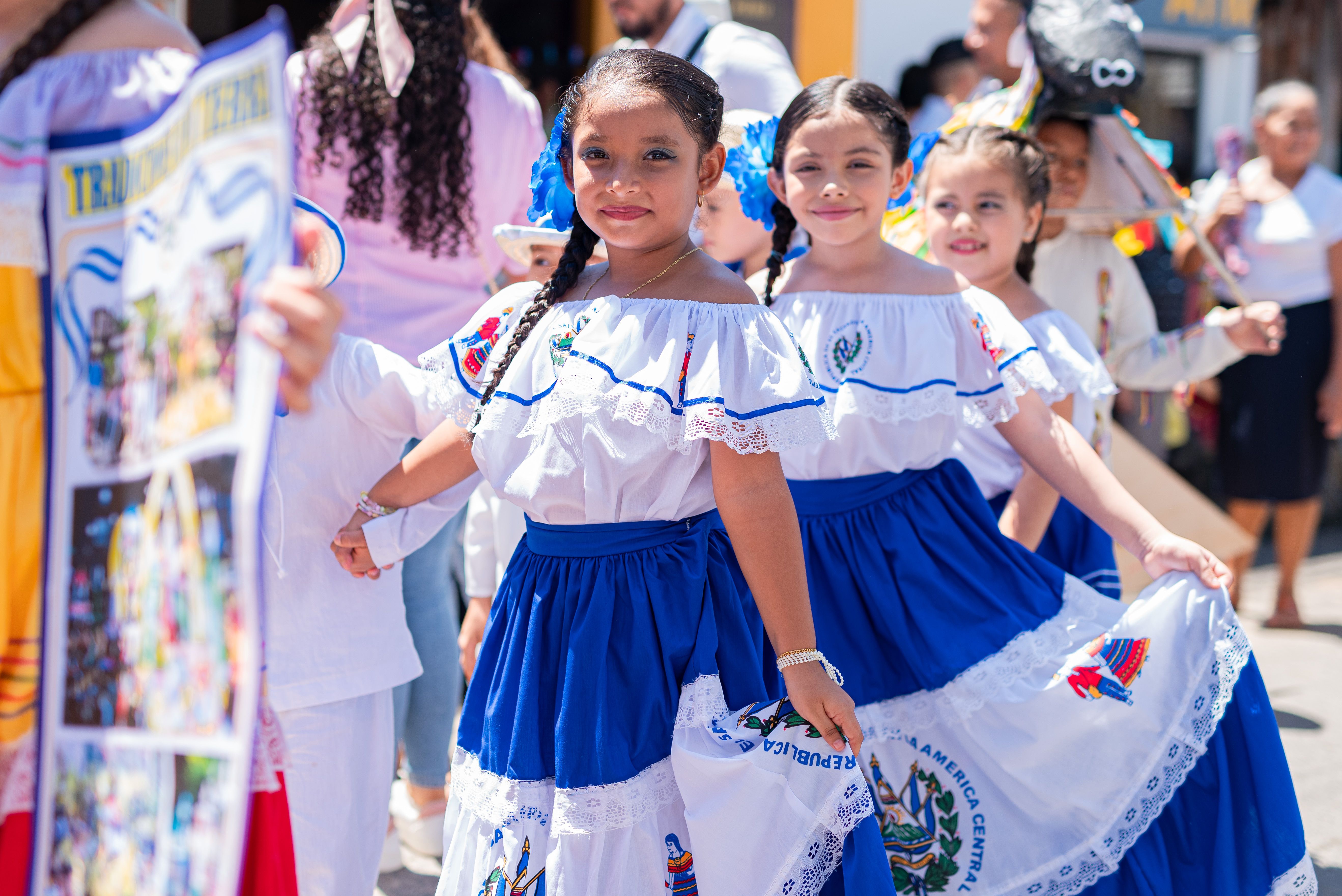 Girls in Traditional Costumes Dancing at a Parade · Free Stock Photo
