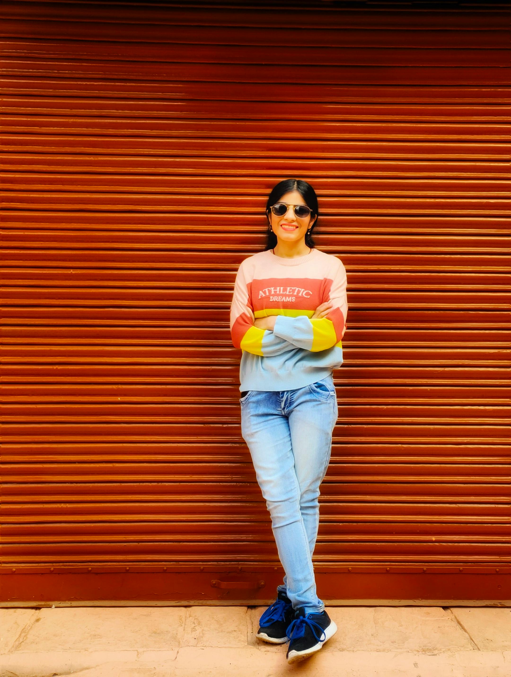 Woman Wearing Casual Outfit in Front of Garage · Free Stock Photo