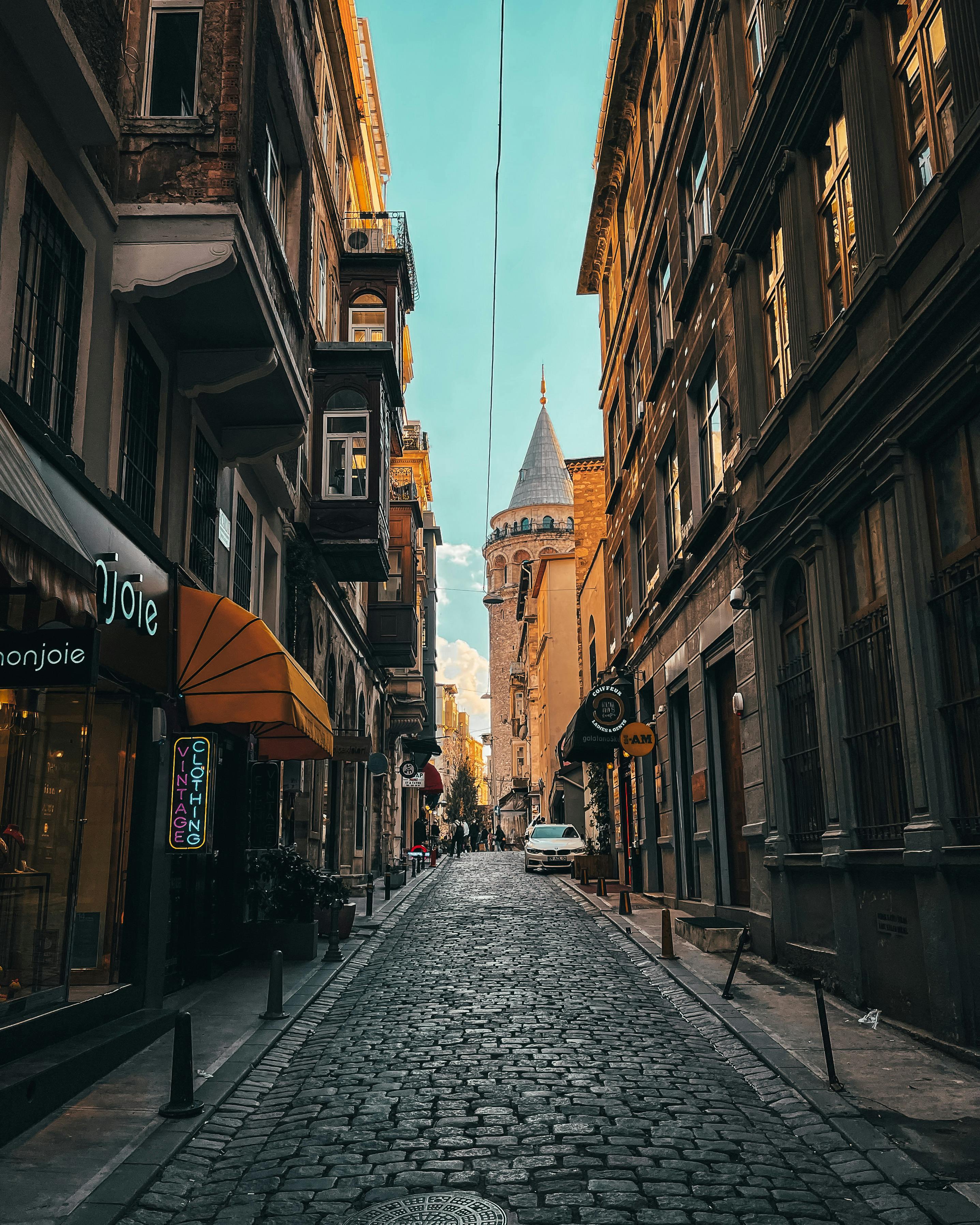 Paved Alley in Istanbul with a View of Galata Tower · Free Stock Photo