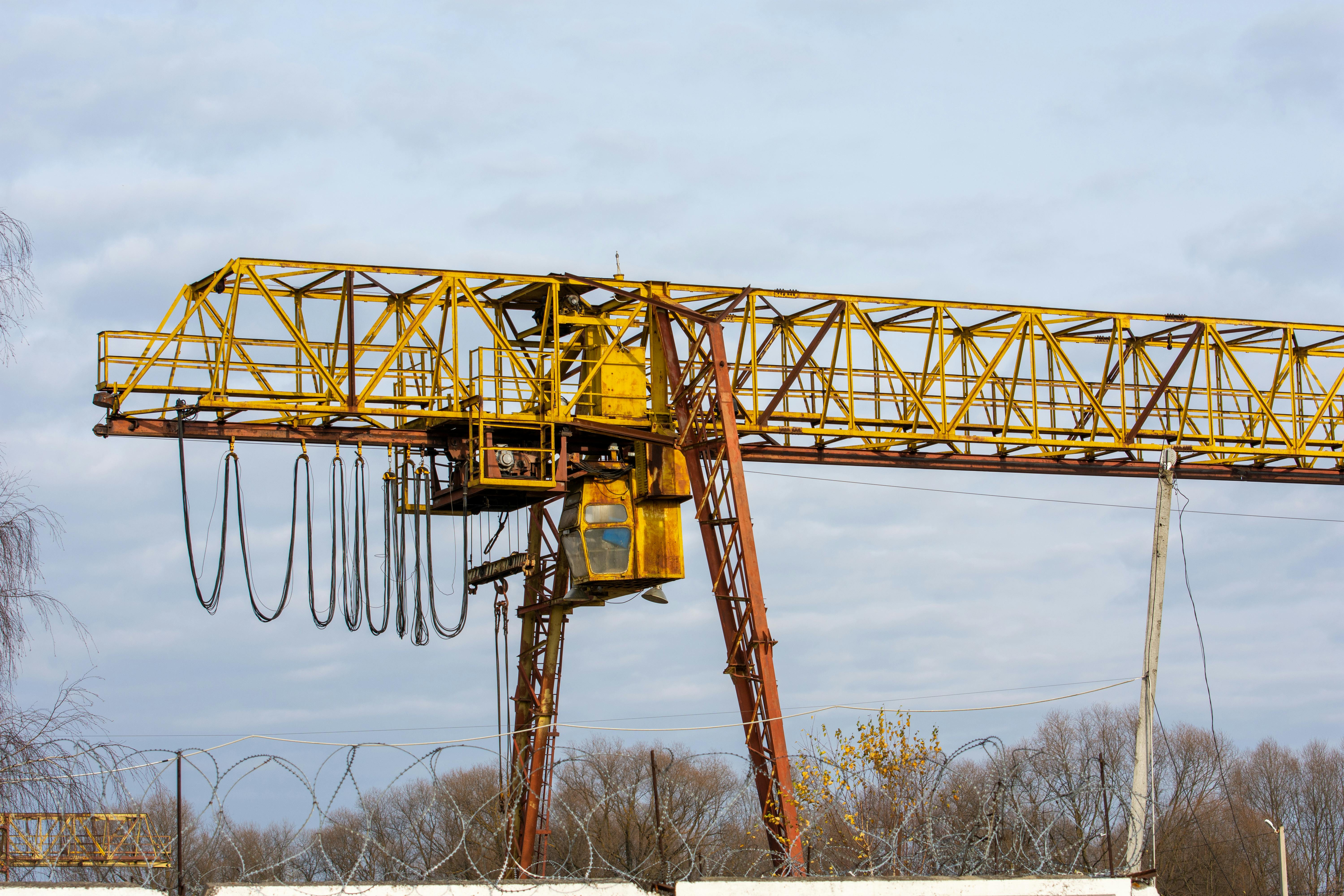 Crane behind Fence · Free Stock Photo