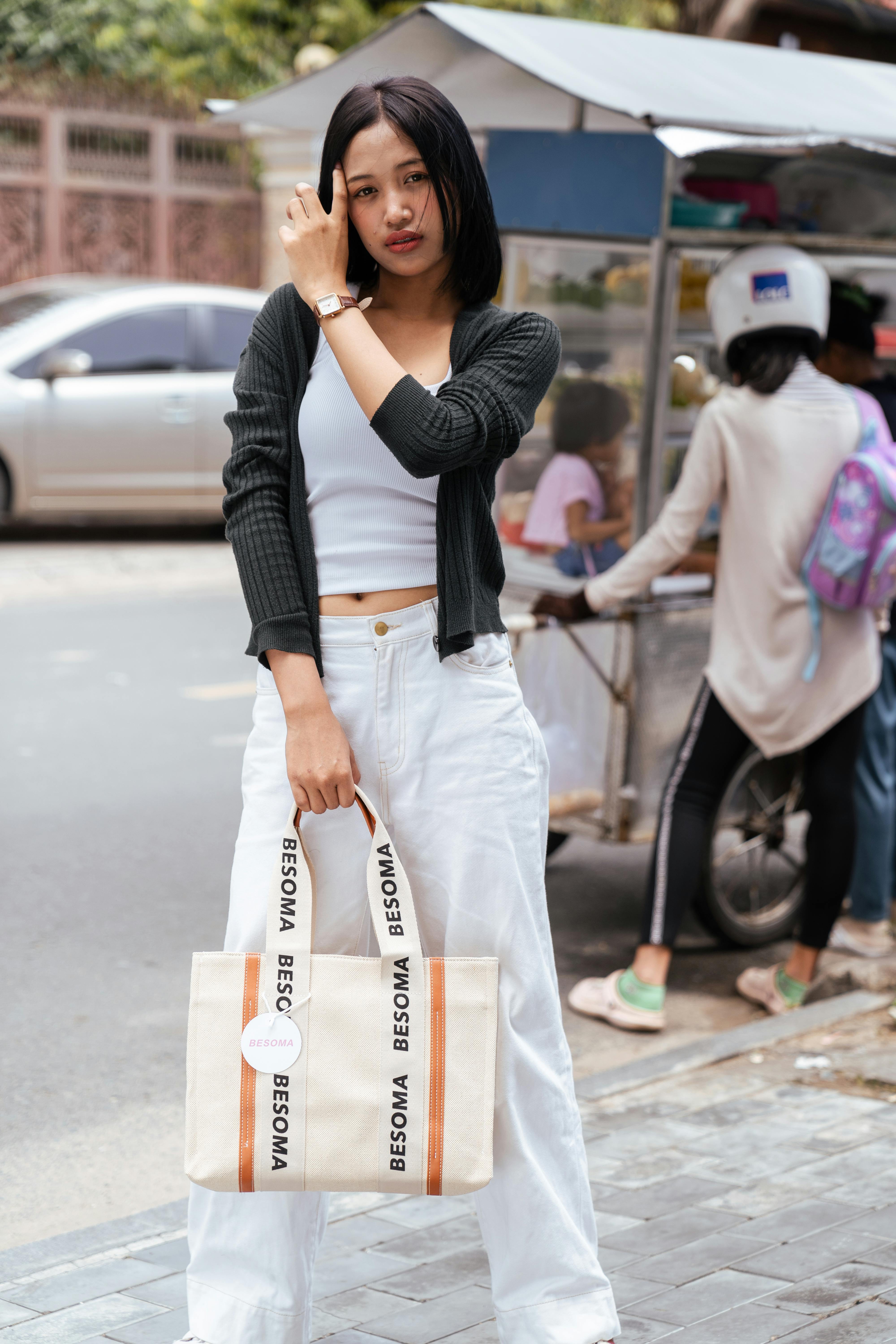 Young Model Posing with Bag · Free Stock Photo