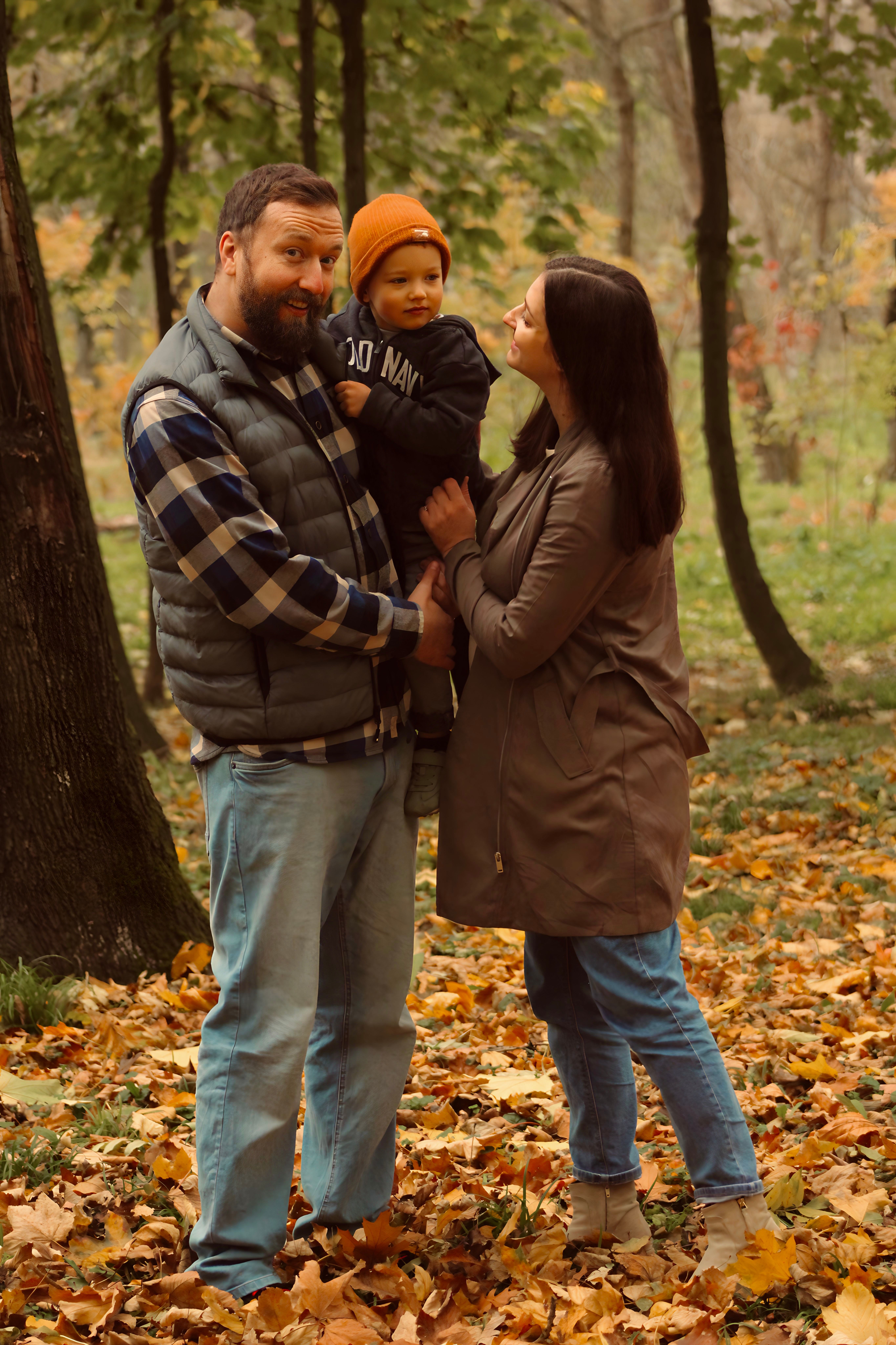 Photo of Family Sitting on Tree Log · Free Stock Photo