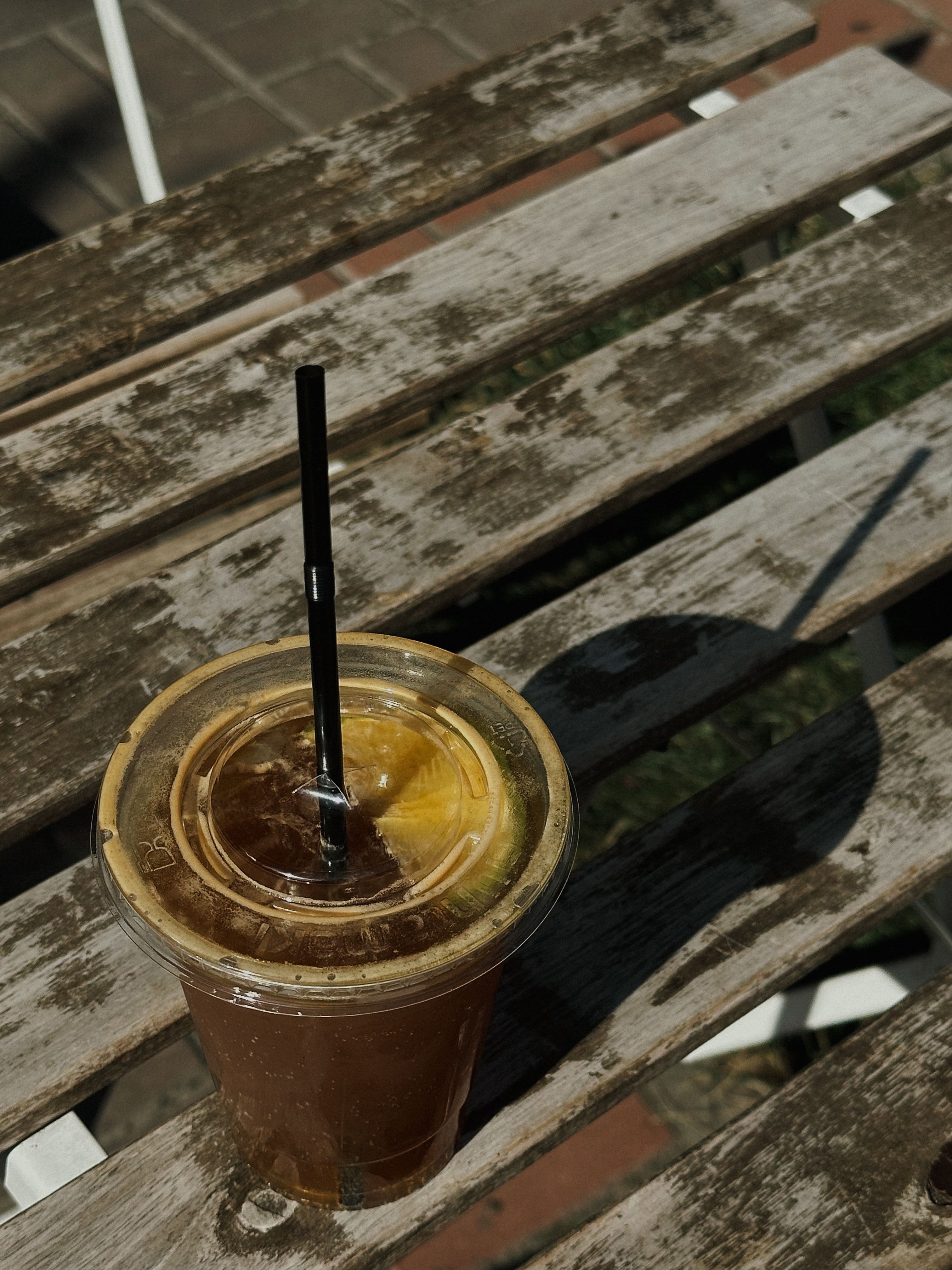 Cold Coffee in Plastic Cup on Wooden Bench · Free Stock Photo