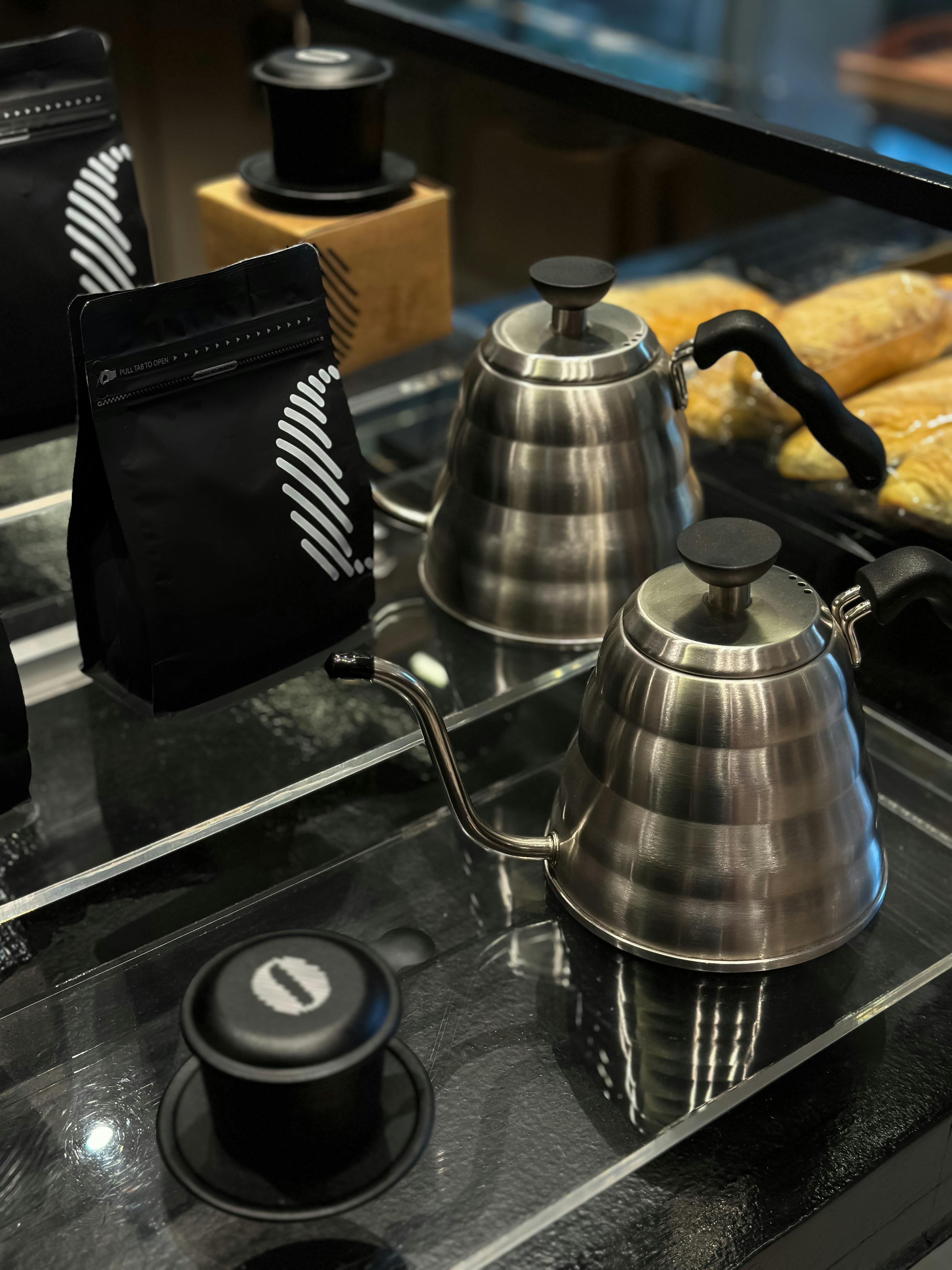 Two Kettles and a Packet of Coffee · Free Stock Photo
