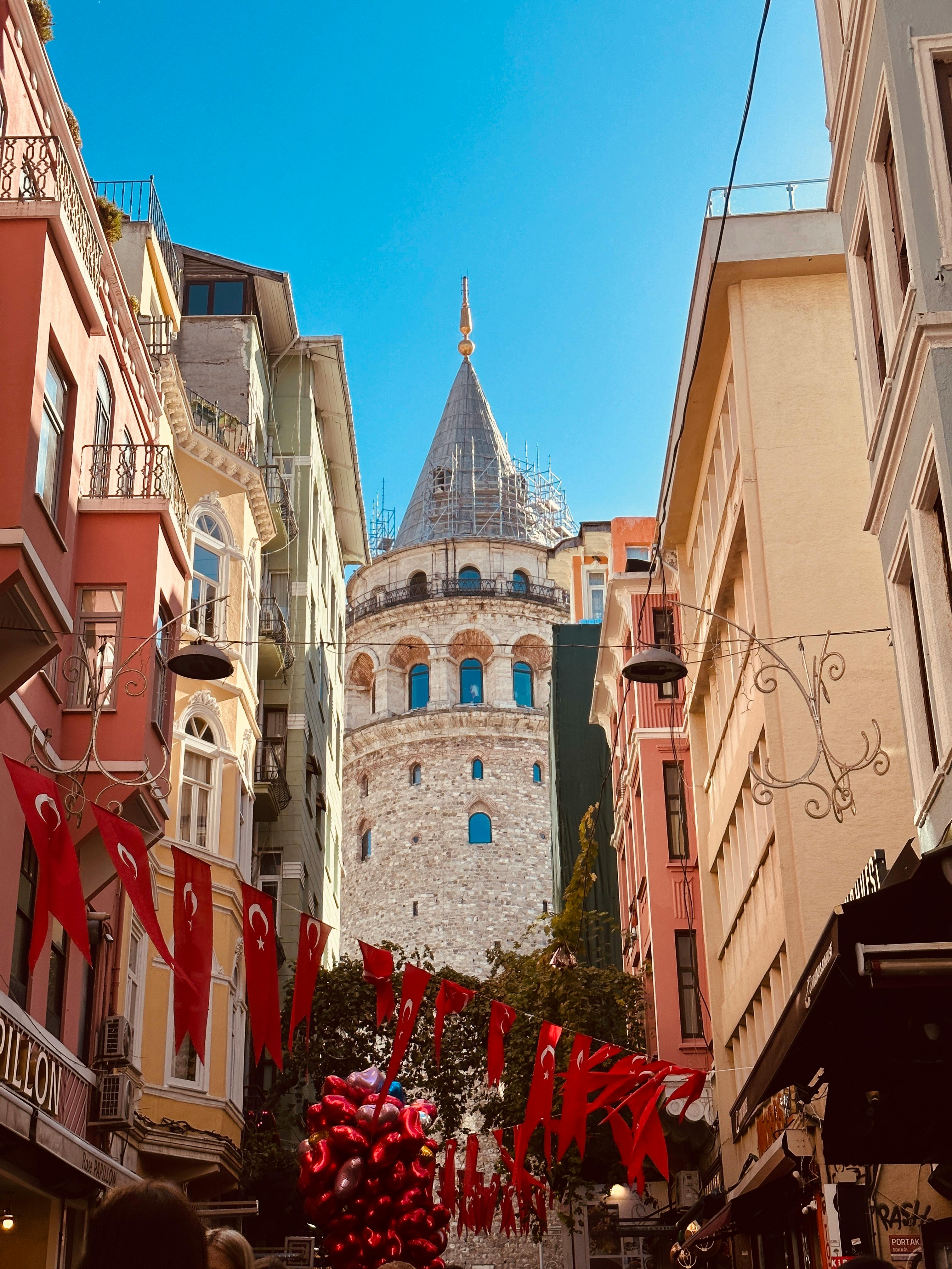 City Street with a Tower and Turkish Flags · Free Stock Photo