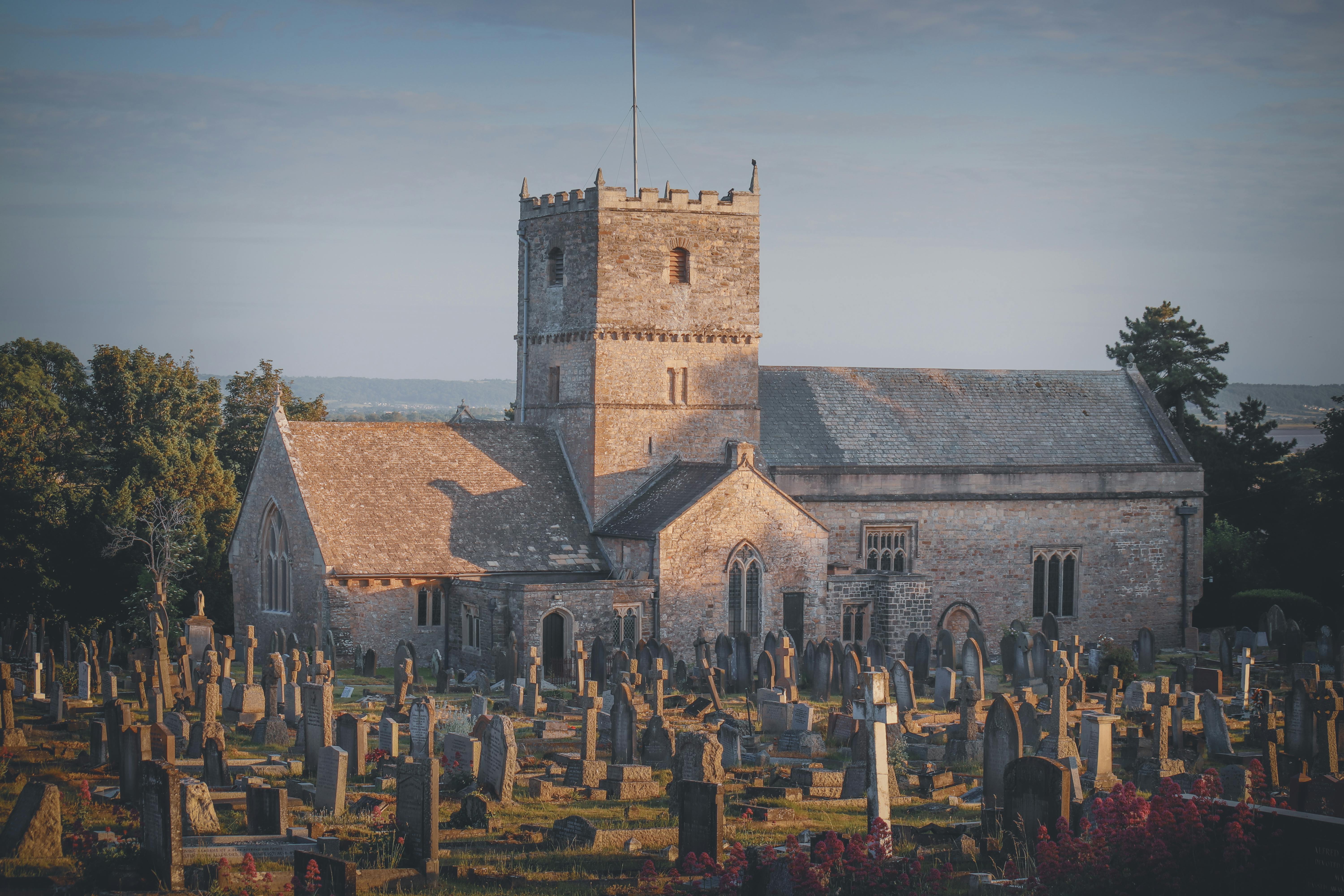 Medieval Church with a Cemetery · Free Stock Photo