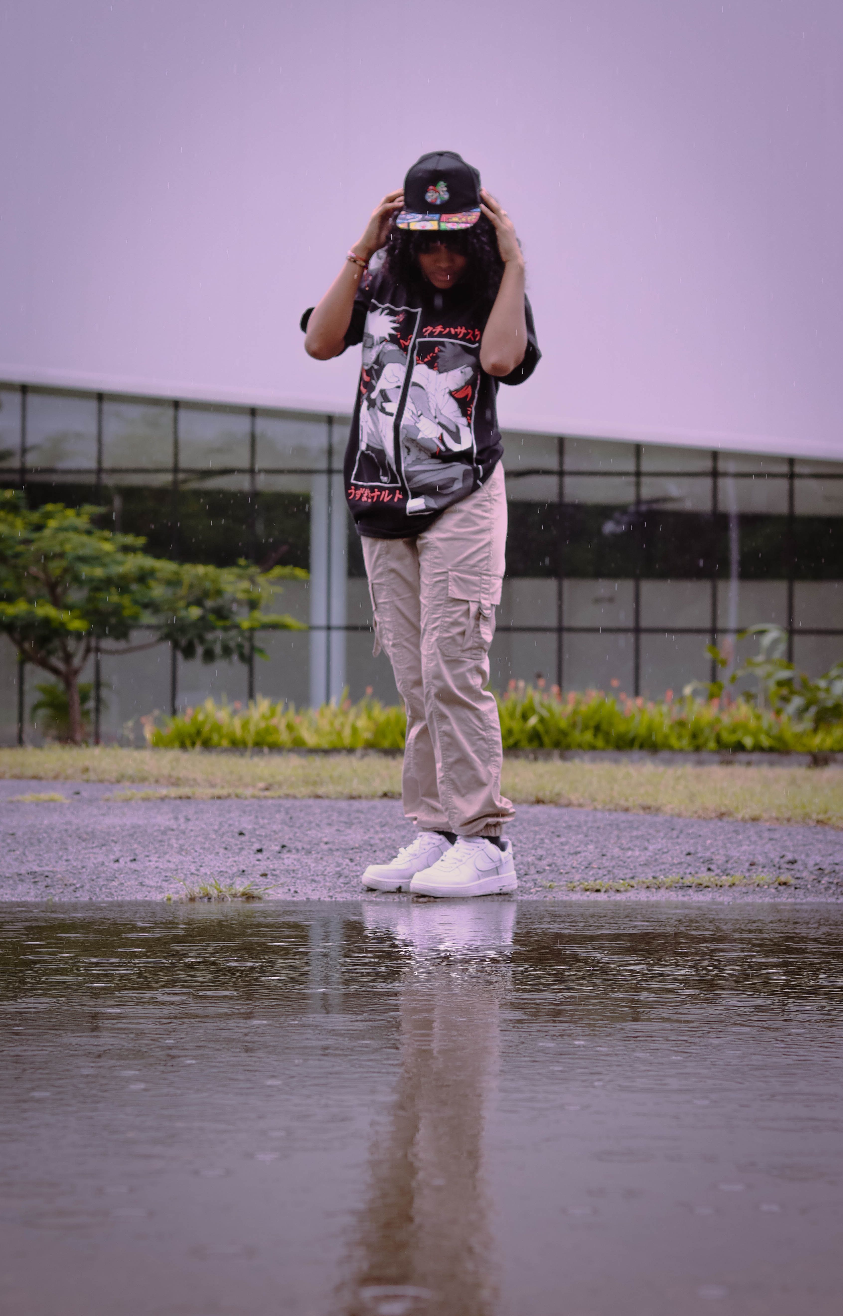 Teenager Standing by the Puddle · Free Stock Photo