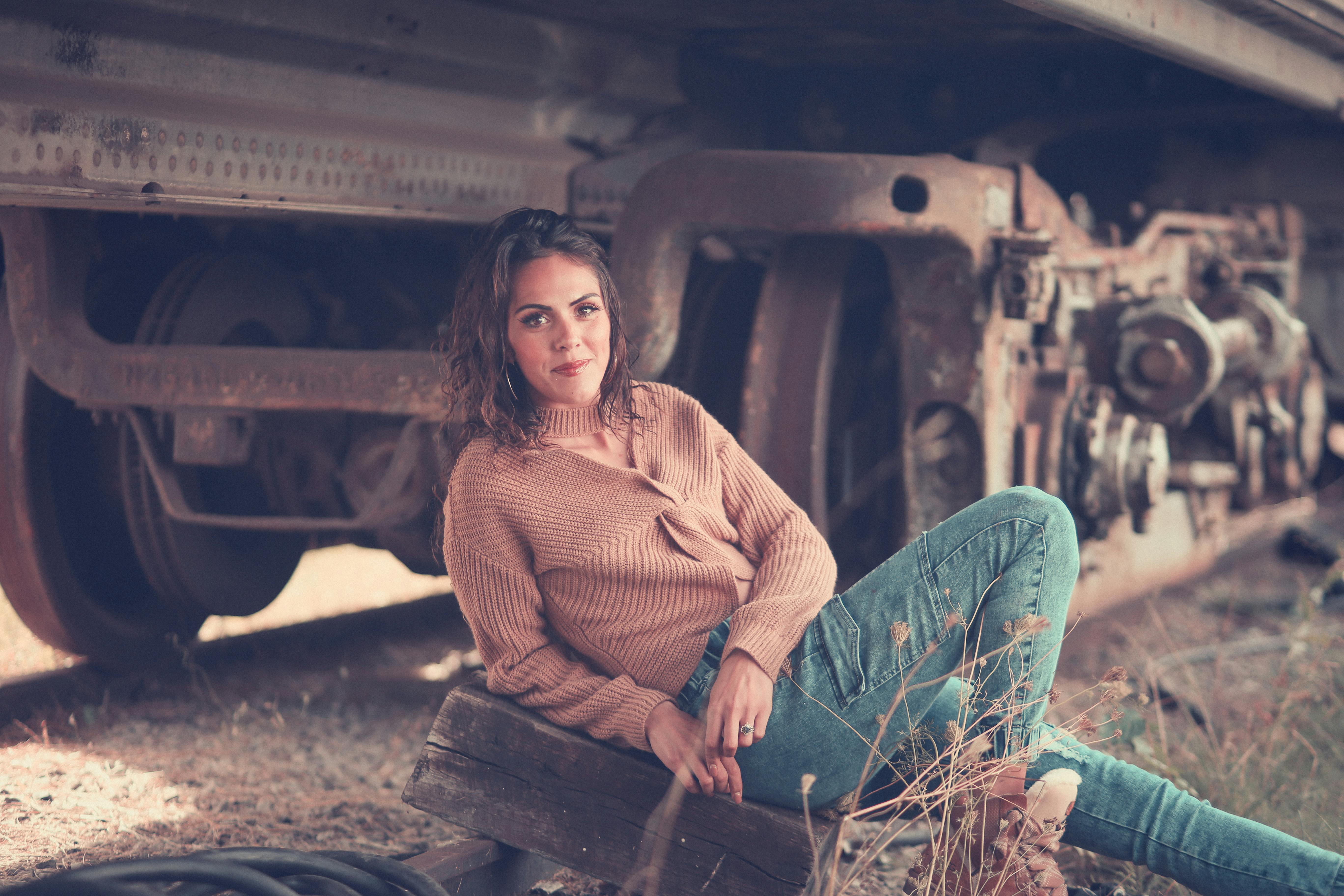 Model Lying Down under Train · Free Stock Photo