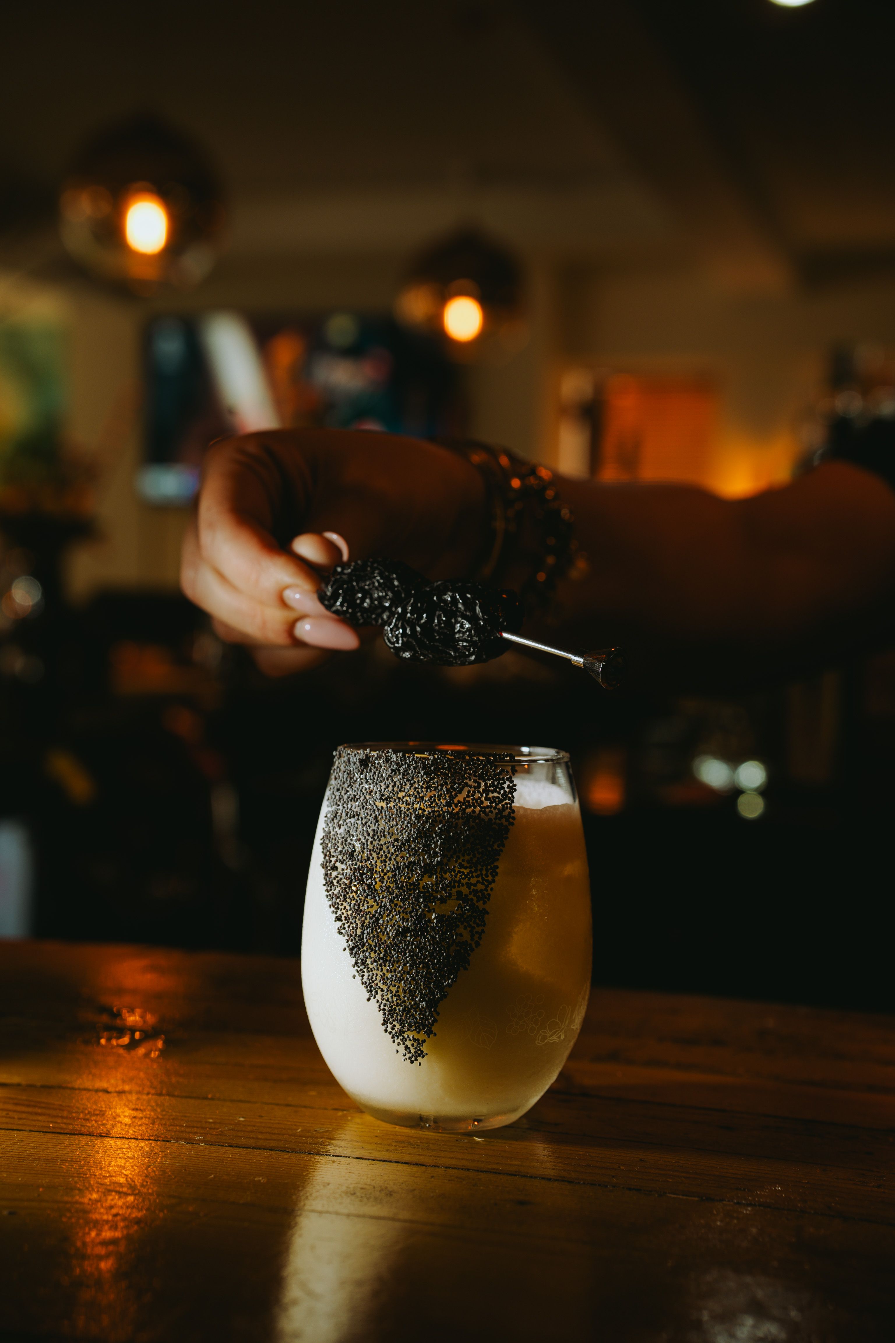 Woman Hand over Glass with Drink · Free Stock Photo